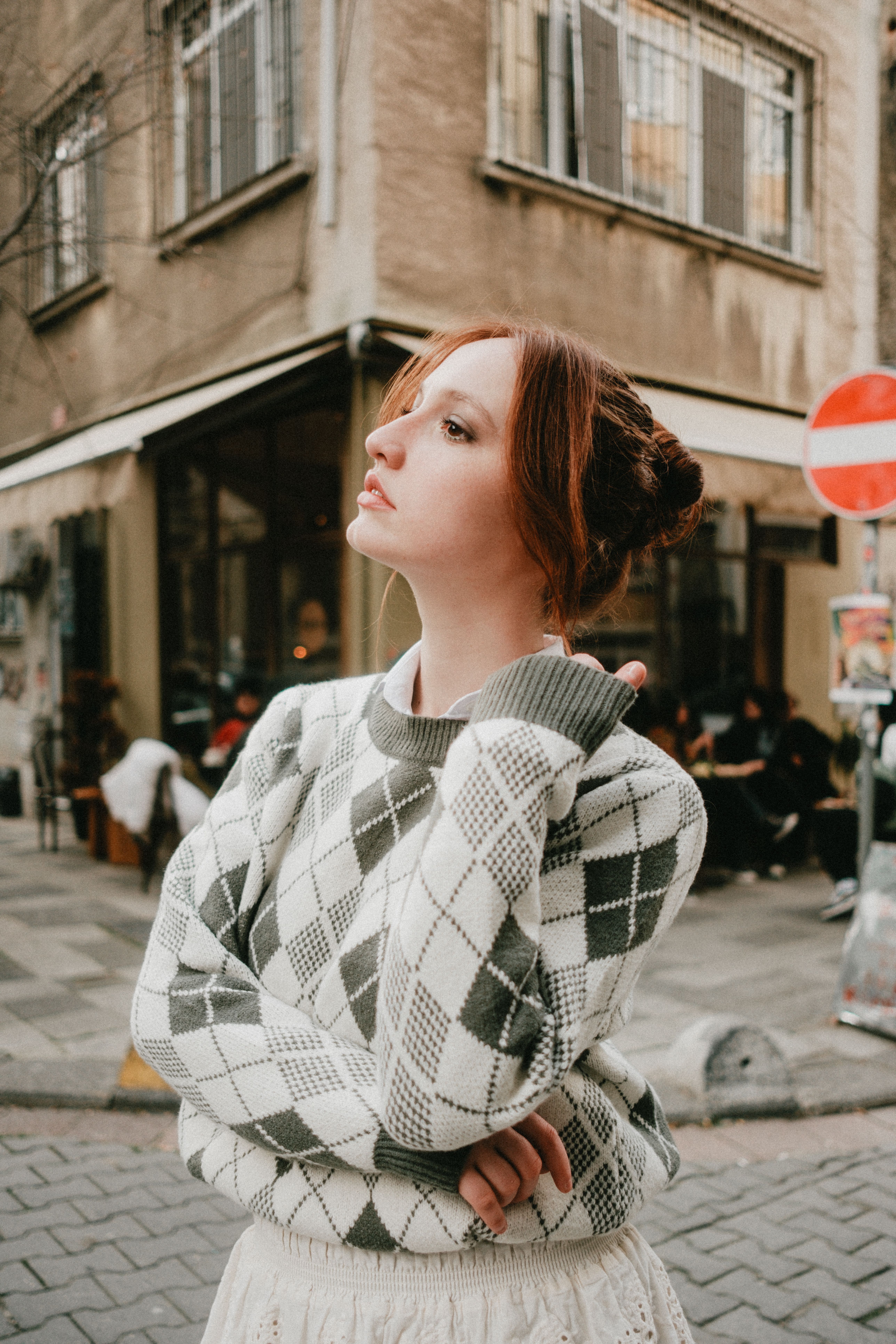 Young Woman Posing on Urban Street Corner · Free Stock Photo