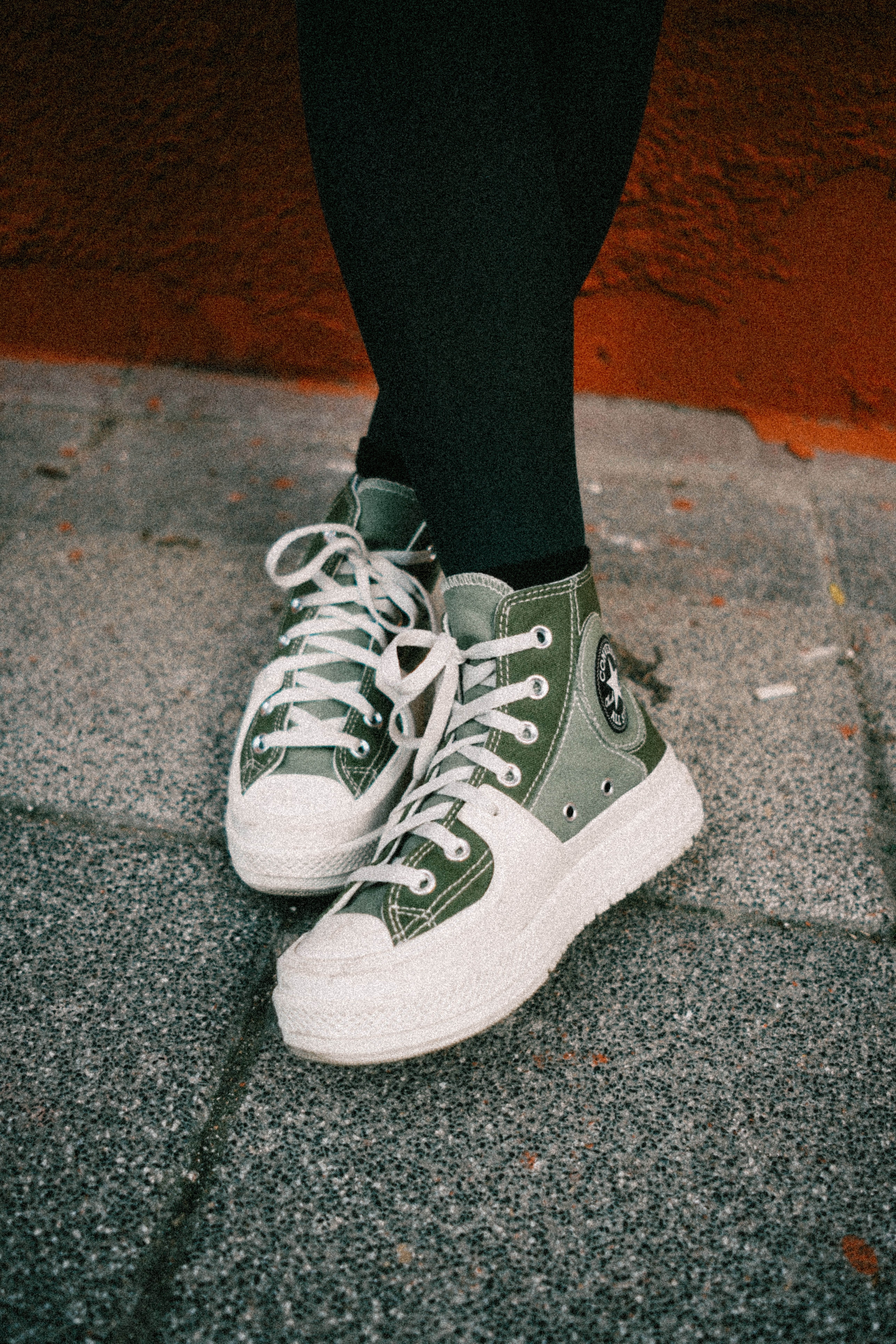 Close-up of Green Sneakers on Pavement Outdoors · Free Stock Photo