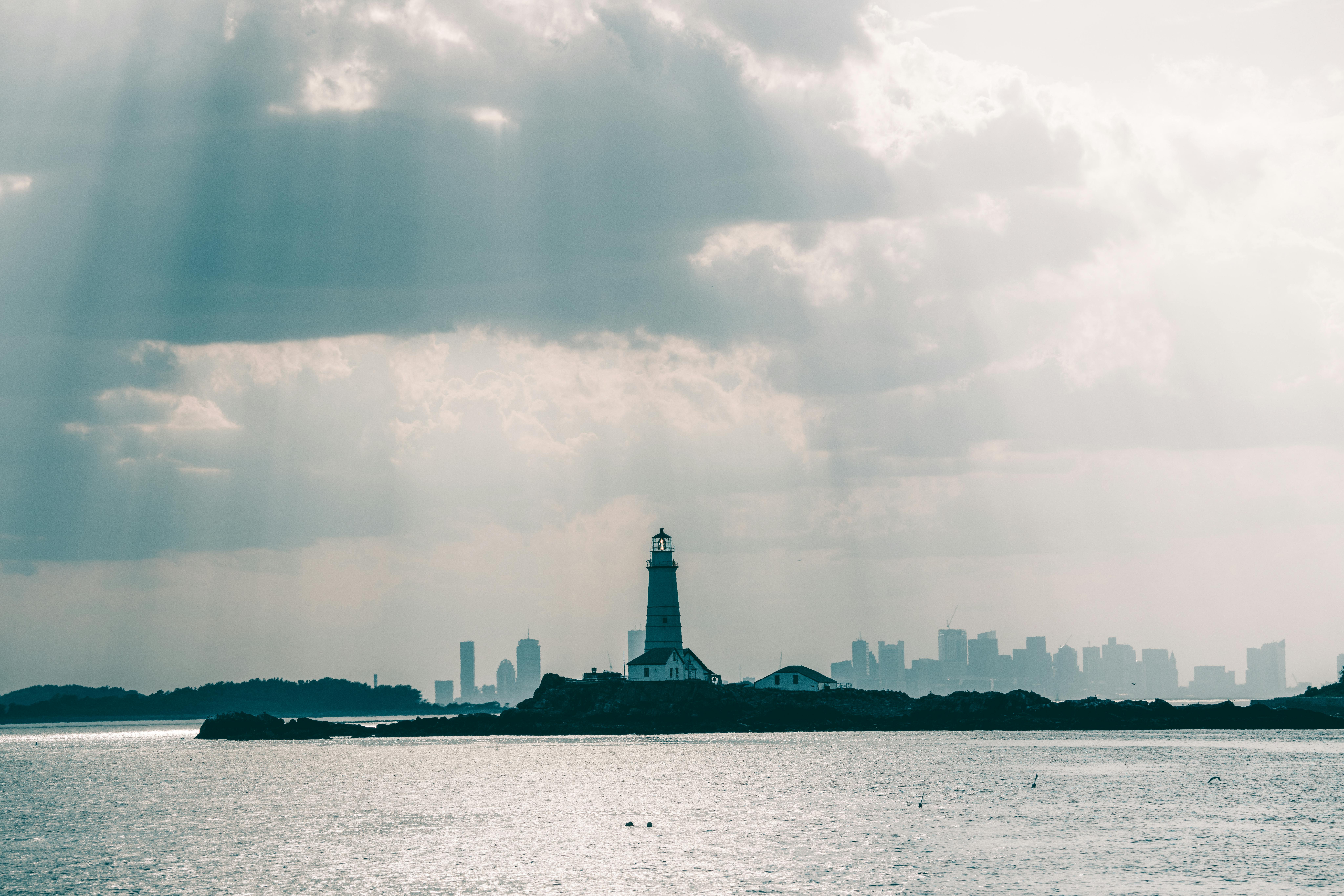 Boston Lighthouse with City Skyline in Background · Free Stock Photo