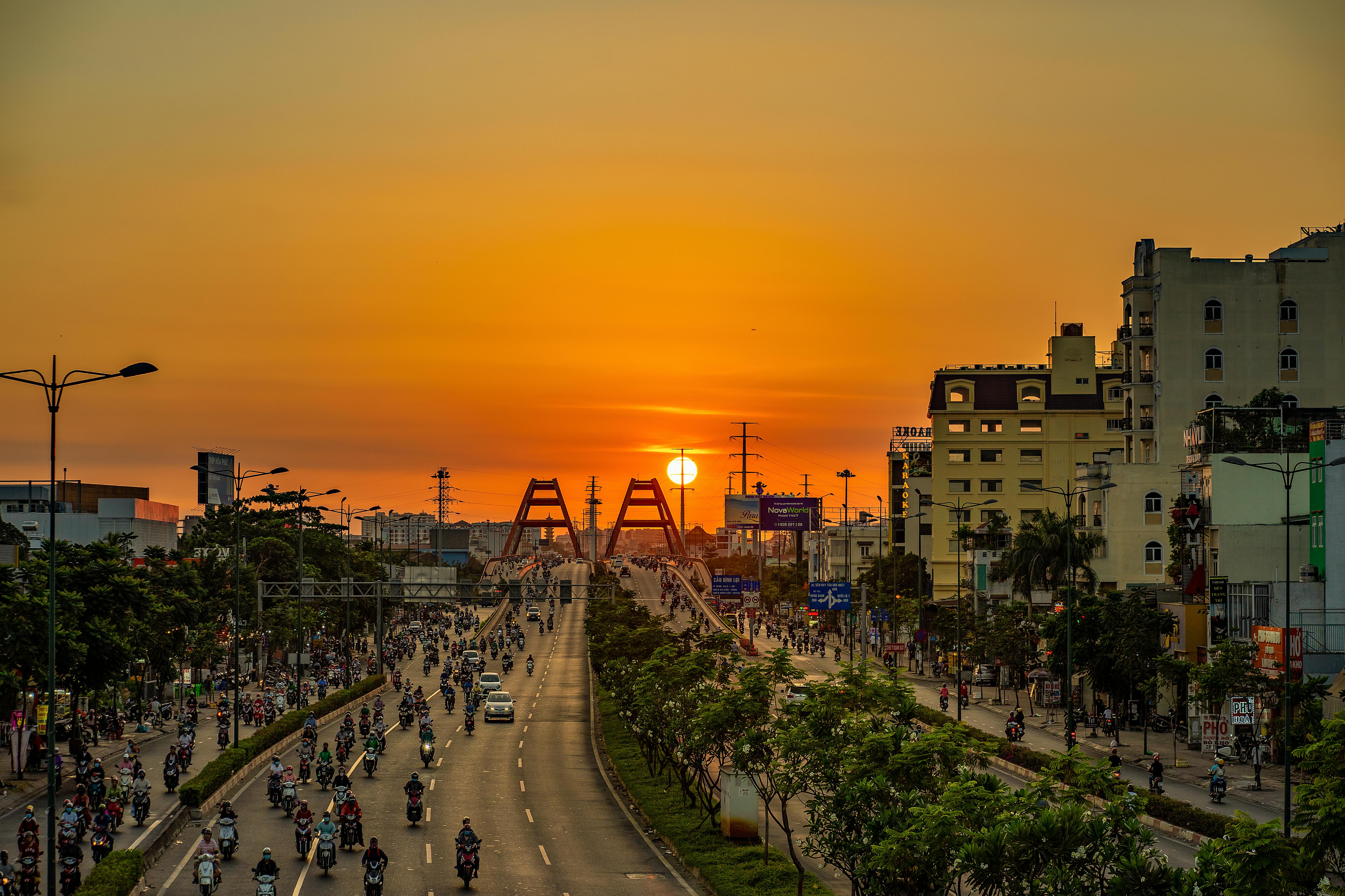 Bustling Saigon Street at Sunset - Vibrant Urban Life · Free Stock Photo