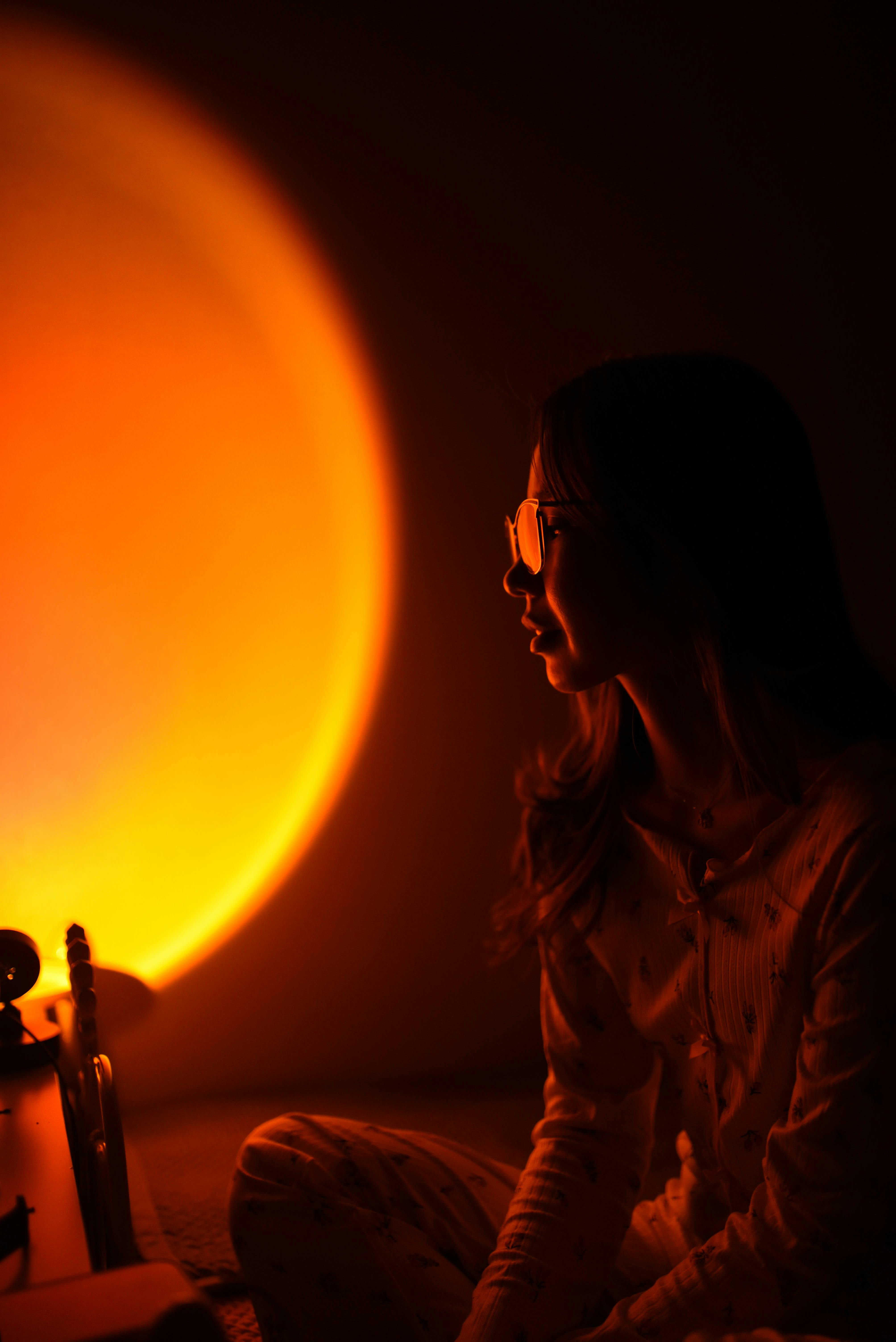 Silhouette of Woman with Warm Light Background · Free Stock Photo