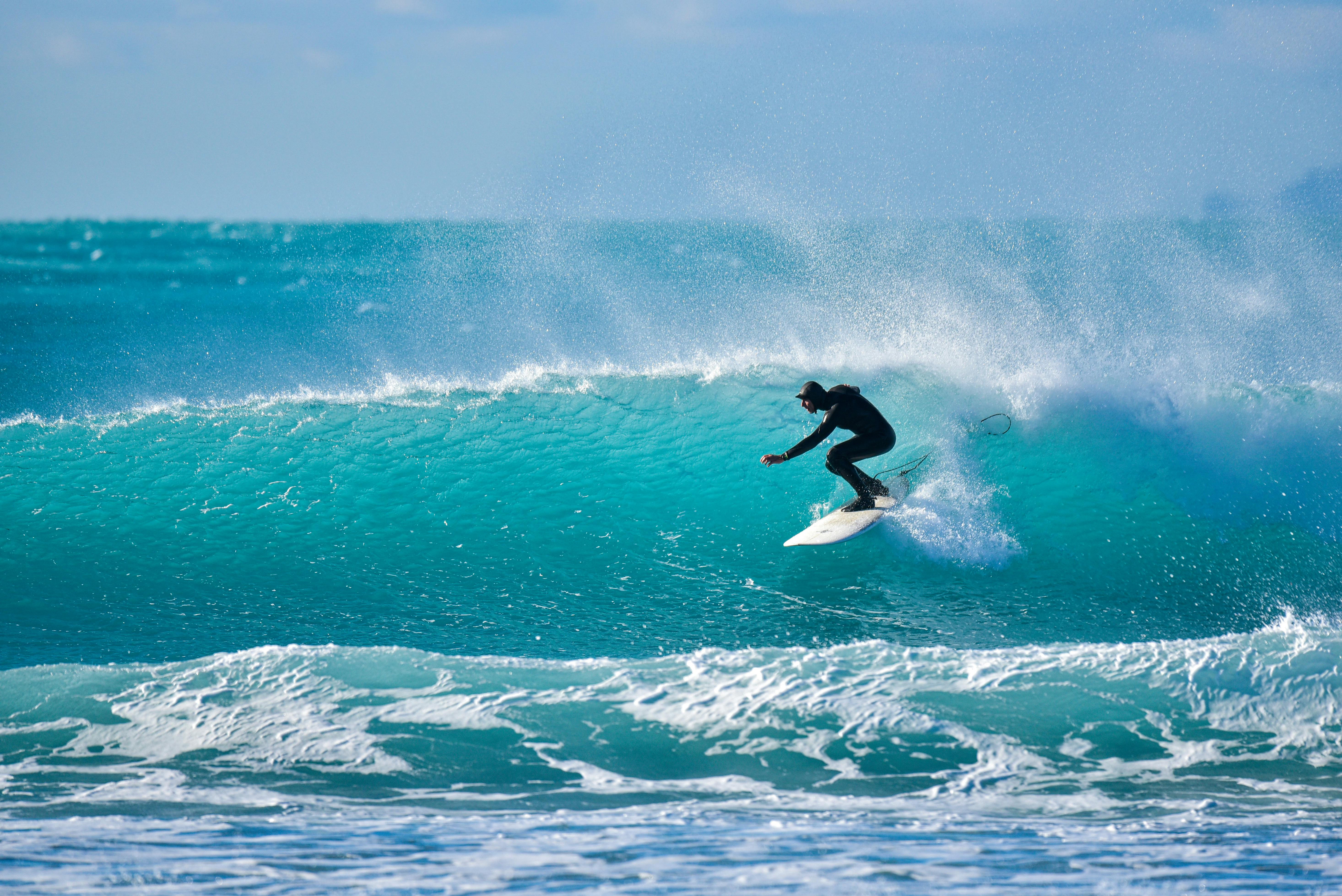 Exciting Surfing Adventure on Turquoise Waves · Free Stock Photo