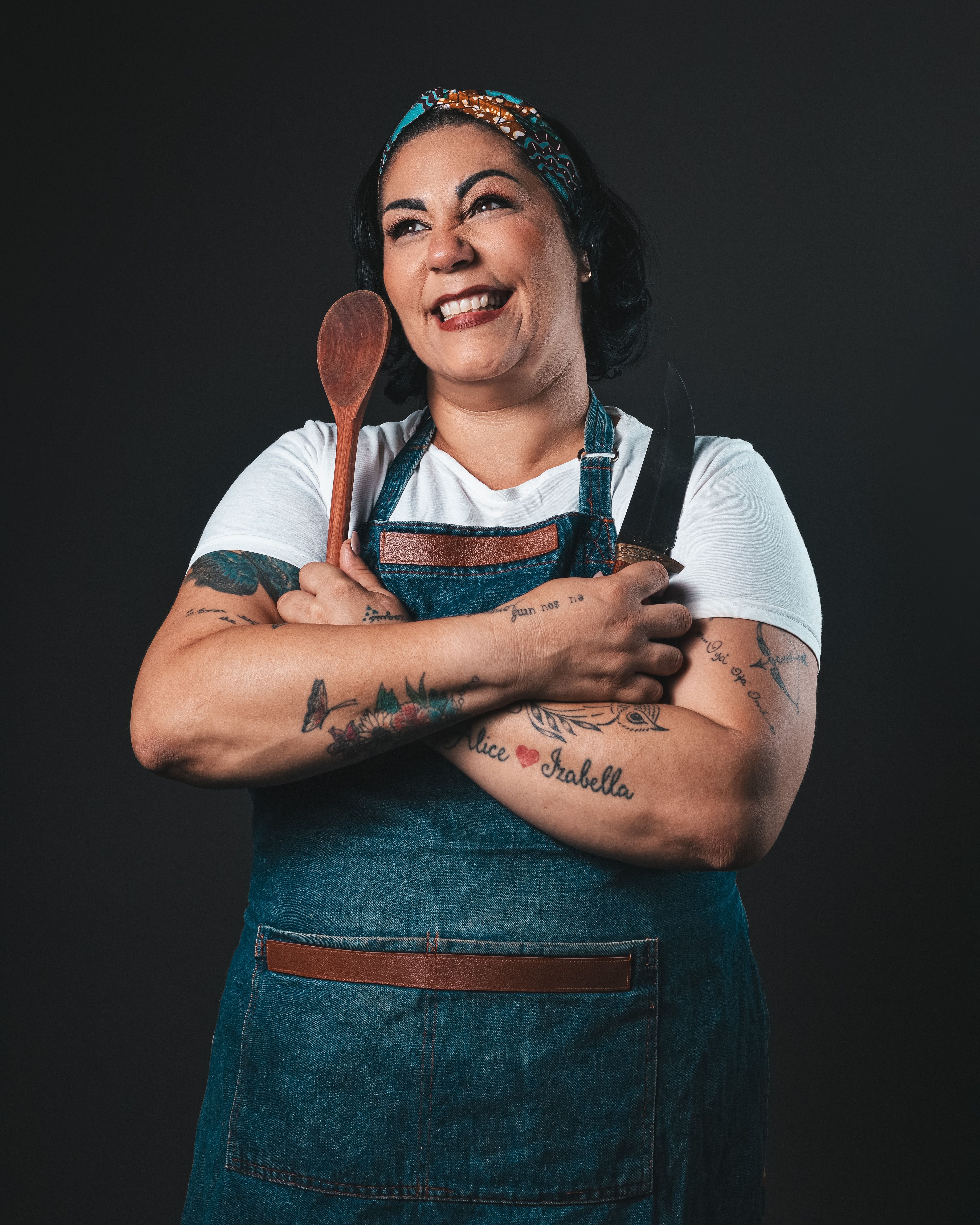 Smiling Chef Holding Kitchen Utensils in Studio · Free Stock Photo