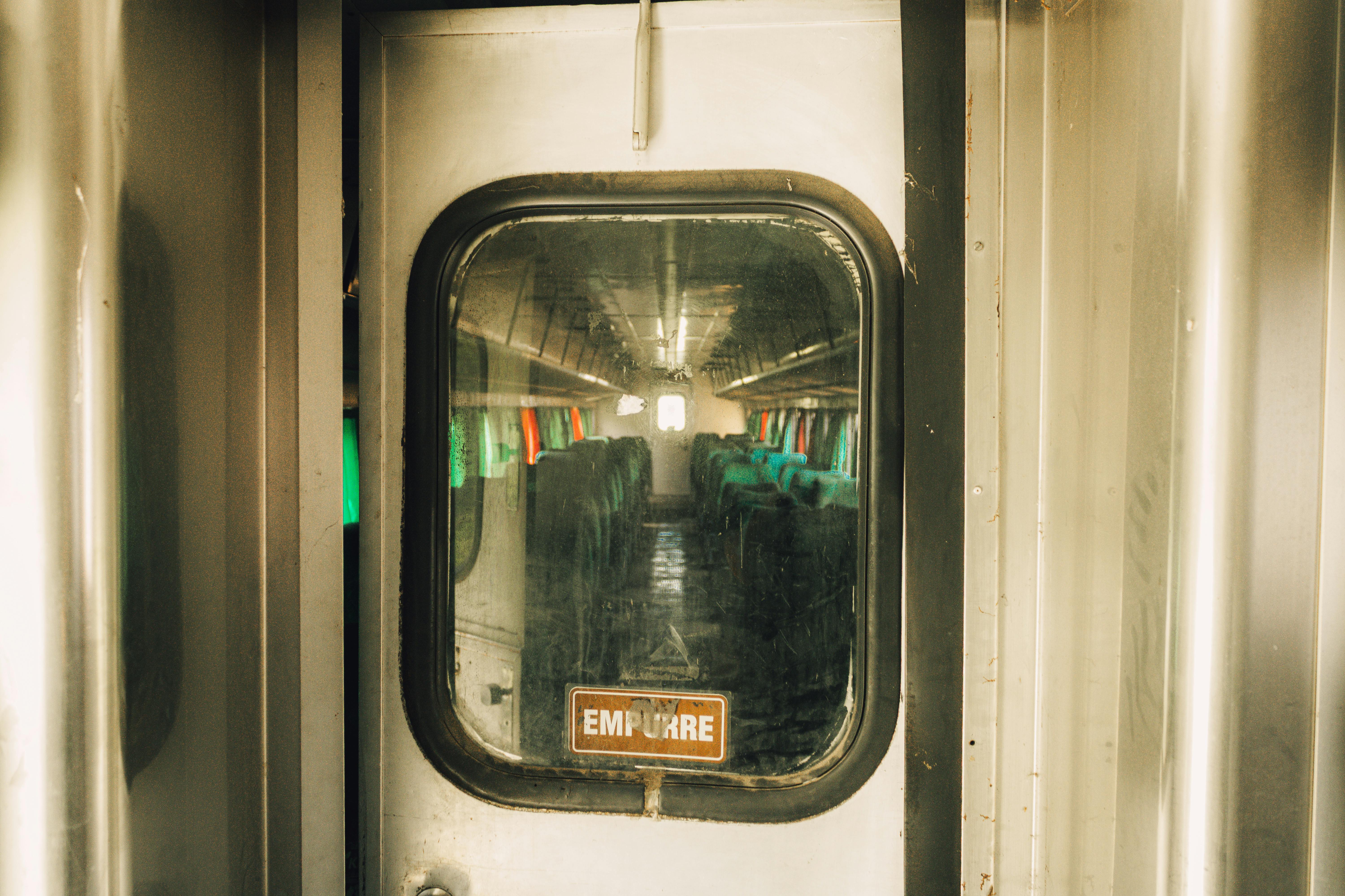 Empty Train Interior Through Glass Door · Free Stock Photo