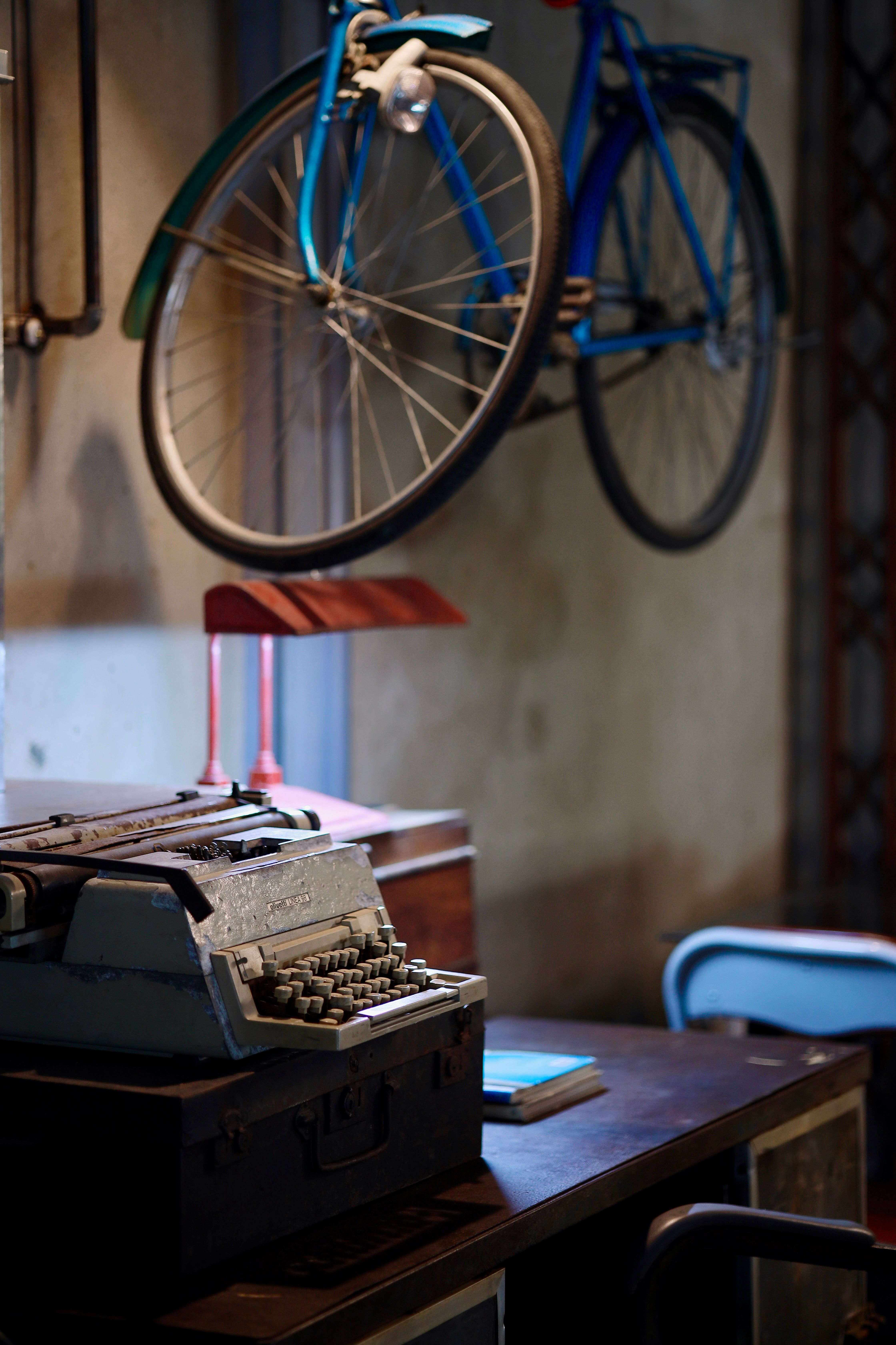 Vintage Inspired Workspace with Bicycle Decor · Free Stock Photo