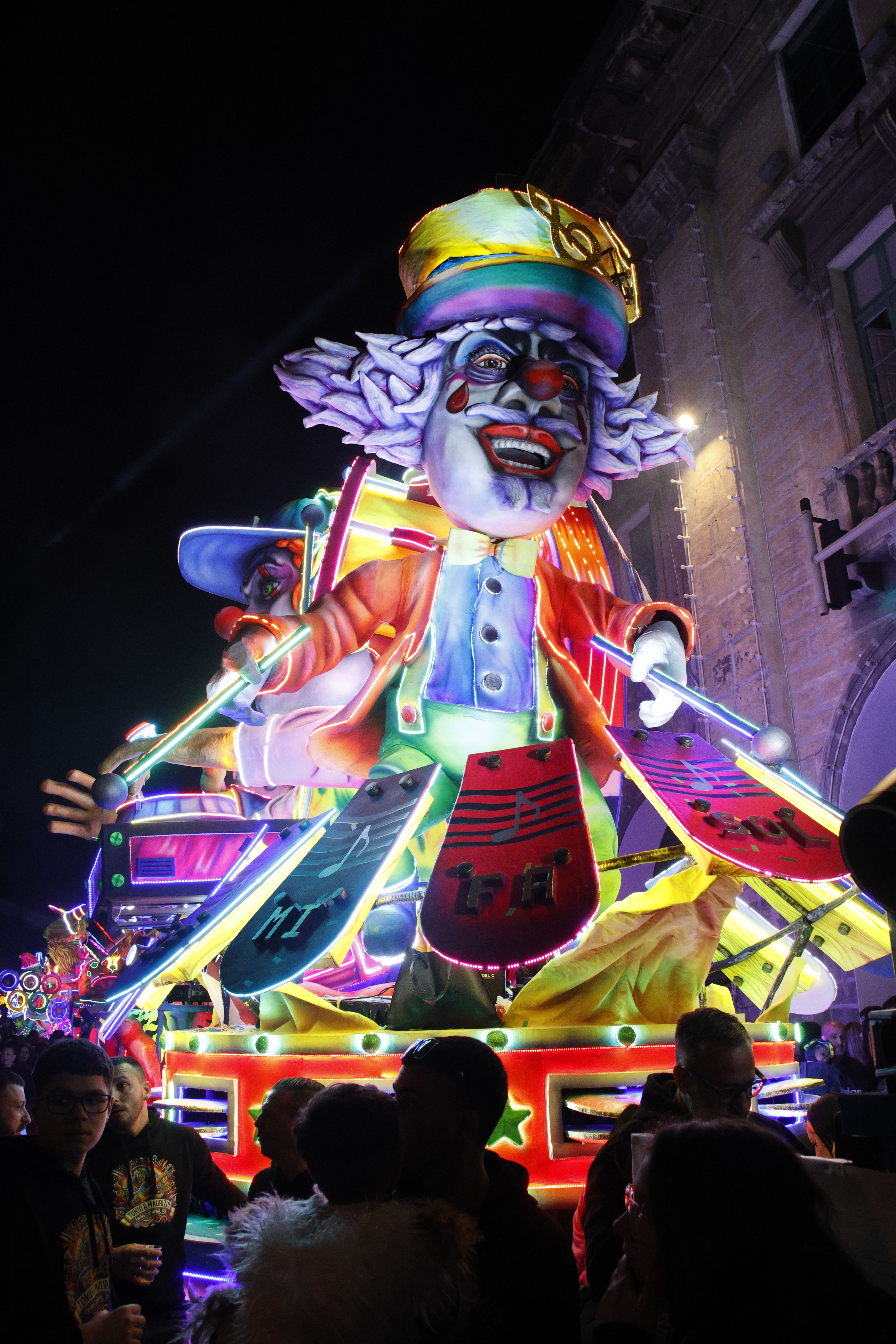 Vibrant Carnival Float with Clown Display at Night · Free Stock Photo