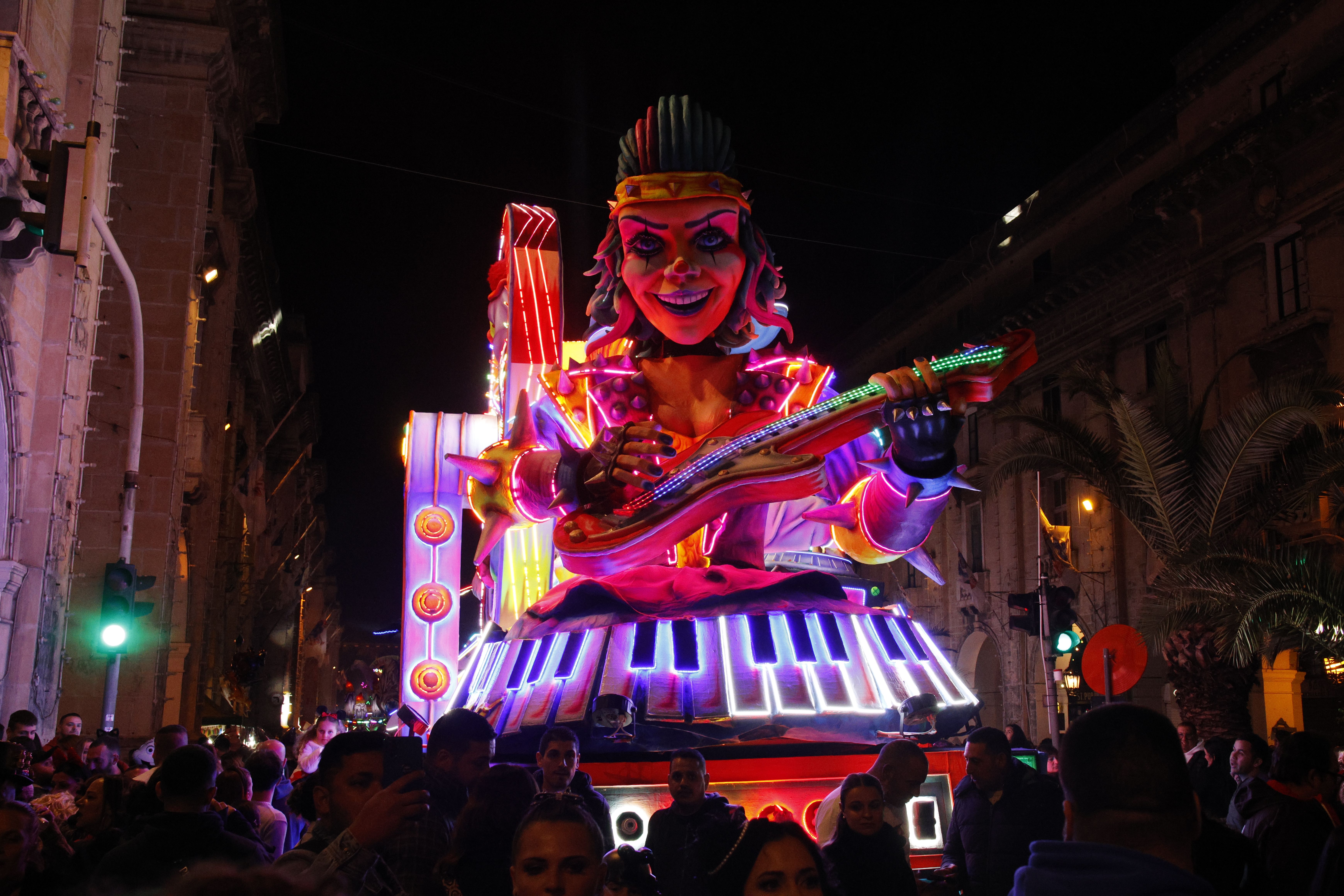Vibrant Night Parade with Neon Music Float · Free Stock Photo