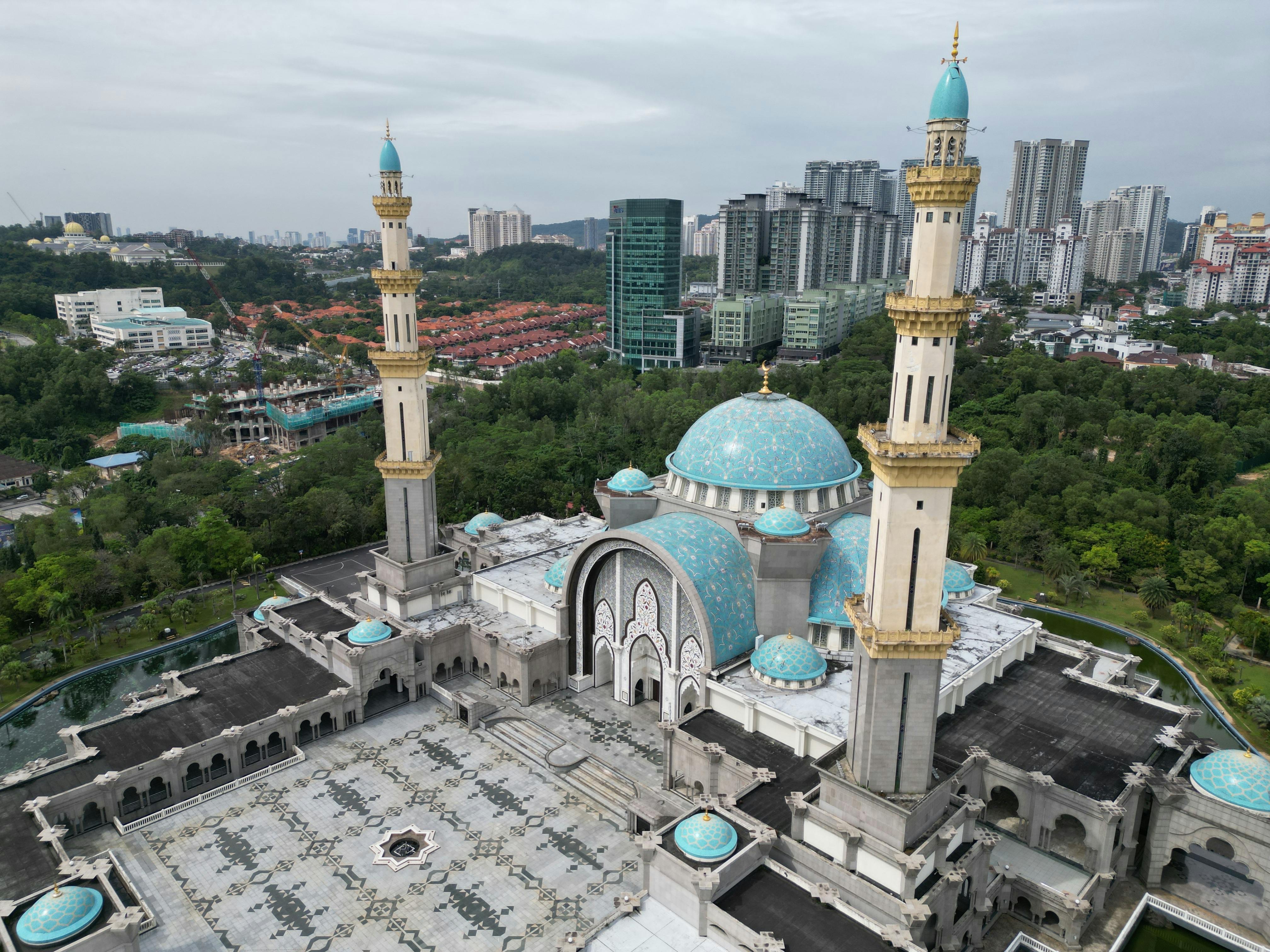 Aerial View of Modern Mosque in Urban Skyline · Free Stock Photo