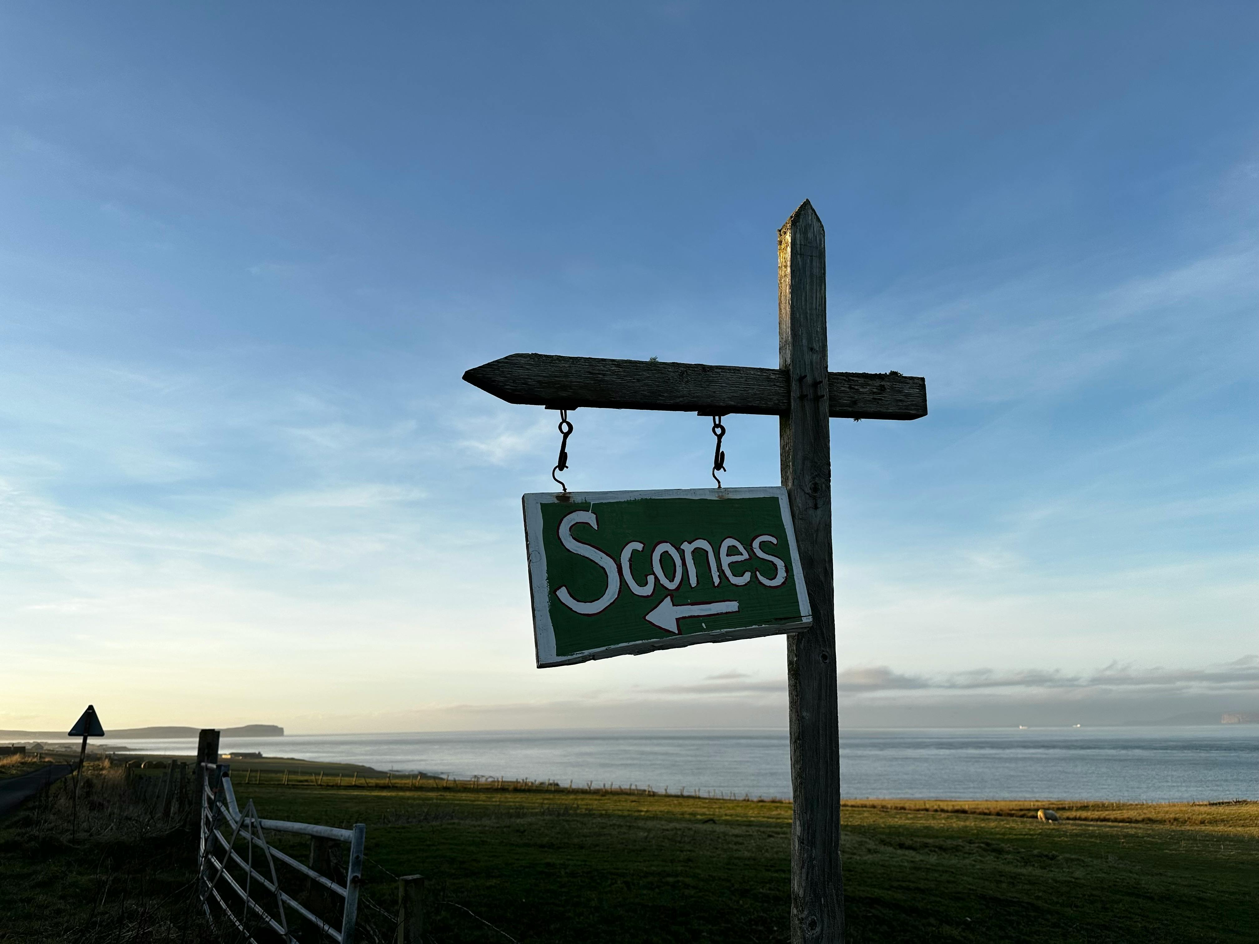 Rustic Sign Pointing to Scones by Seaside · Free Stock Photo