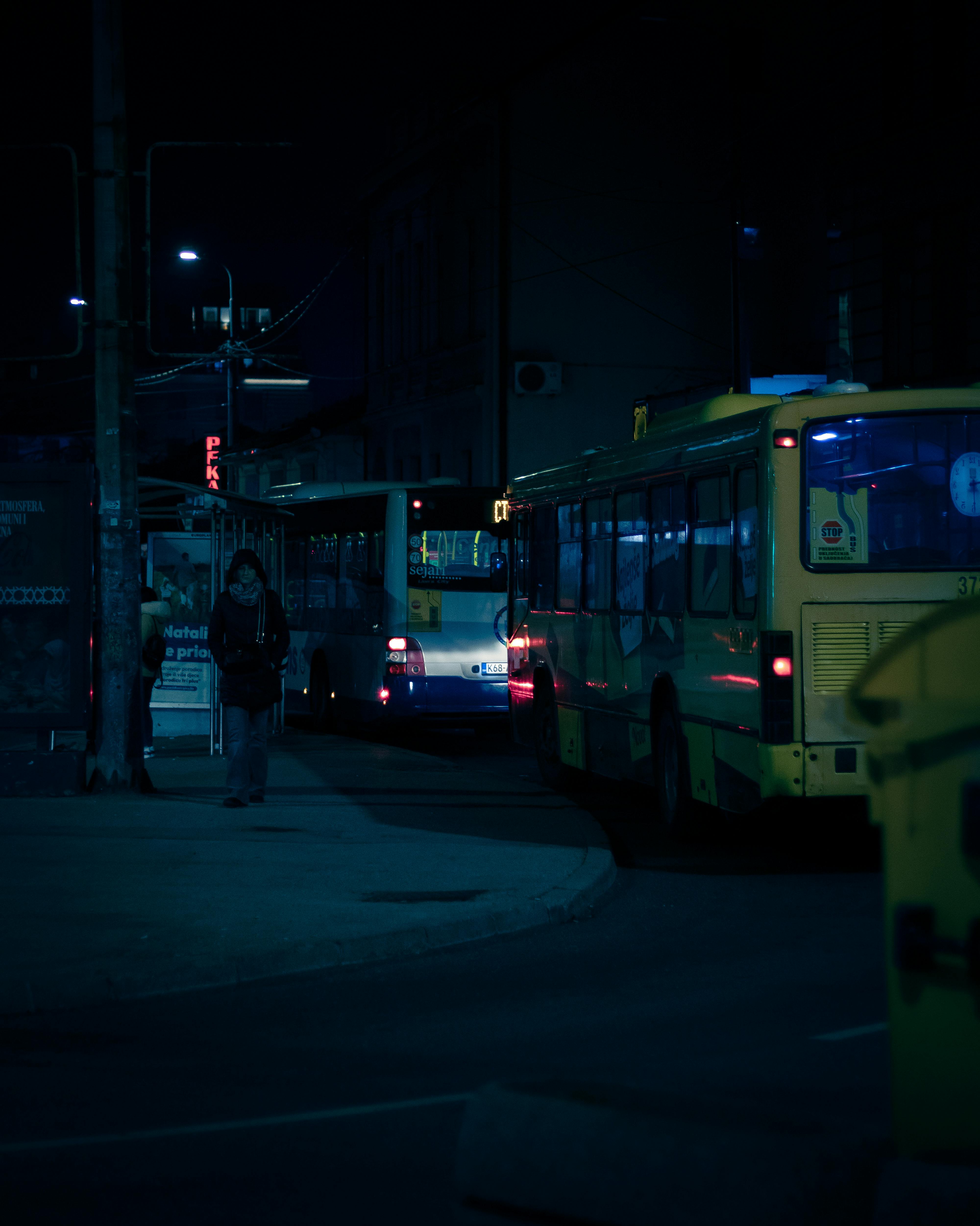 Moody Urban Night Scene with Public Buses · Free Stock Photo