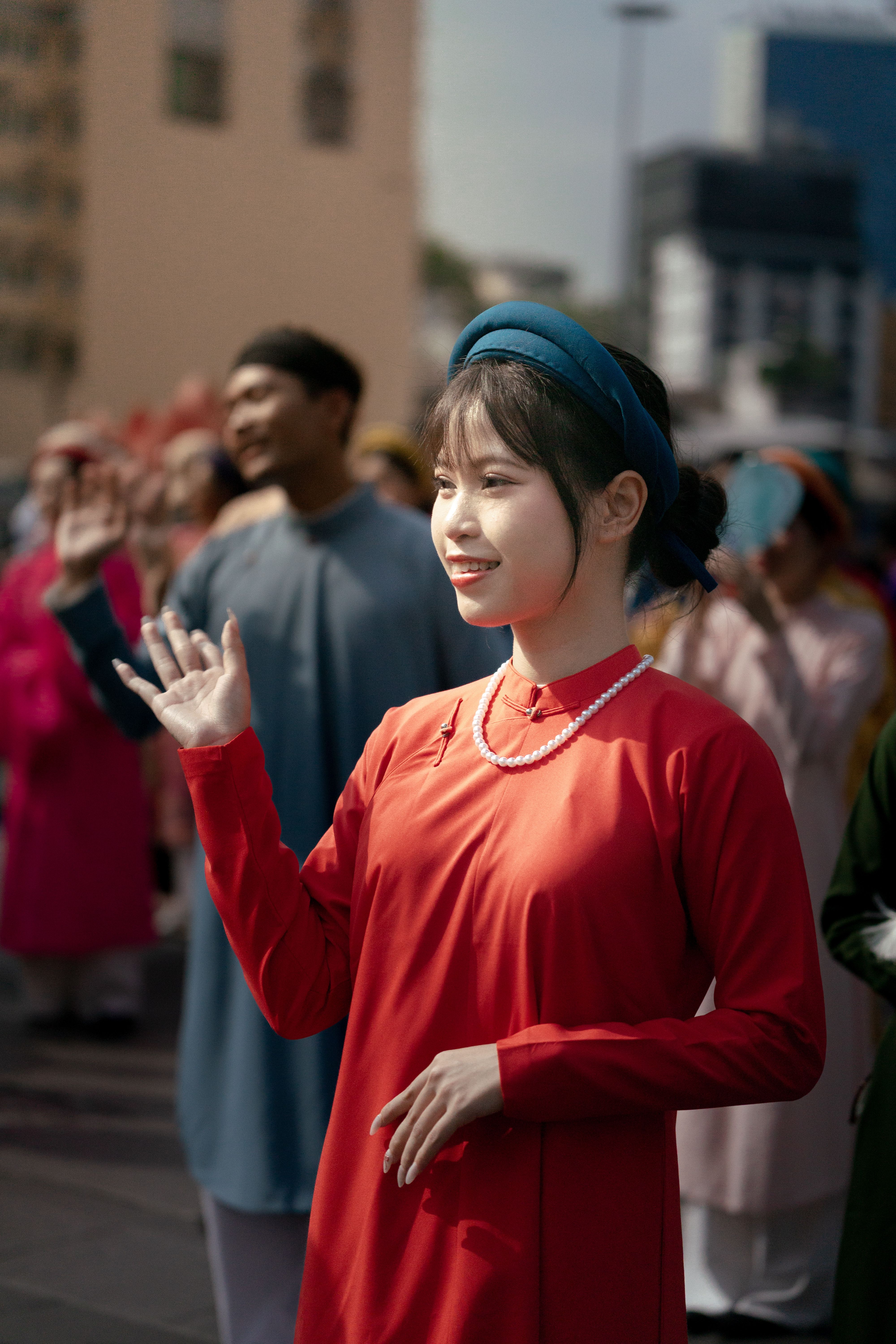 Asian Woman in Traditional Red Dress at Cultural Event · Free Stock Photo