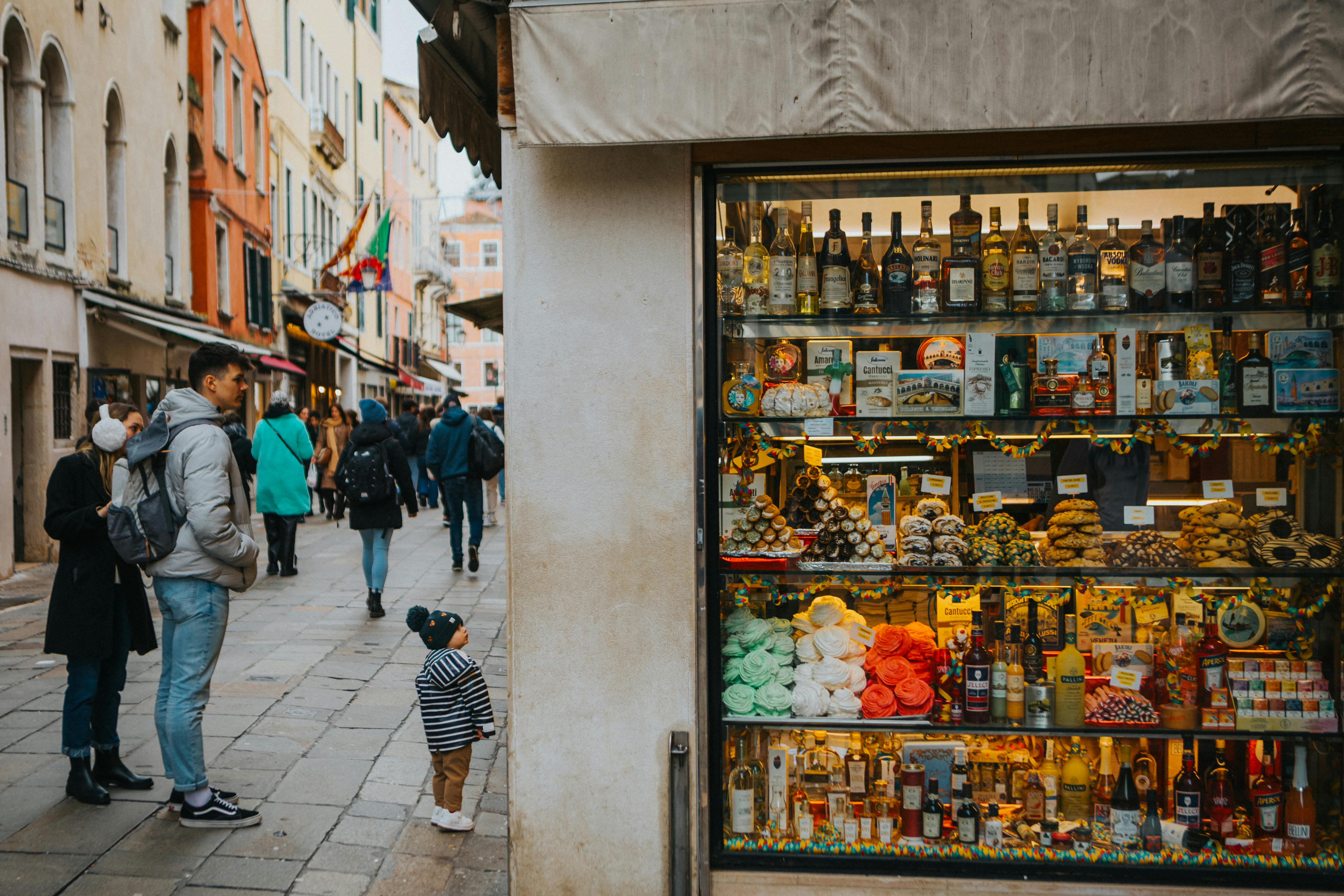 Street View of Italian Storefront with Passersby · Free Stock Photo