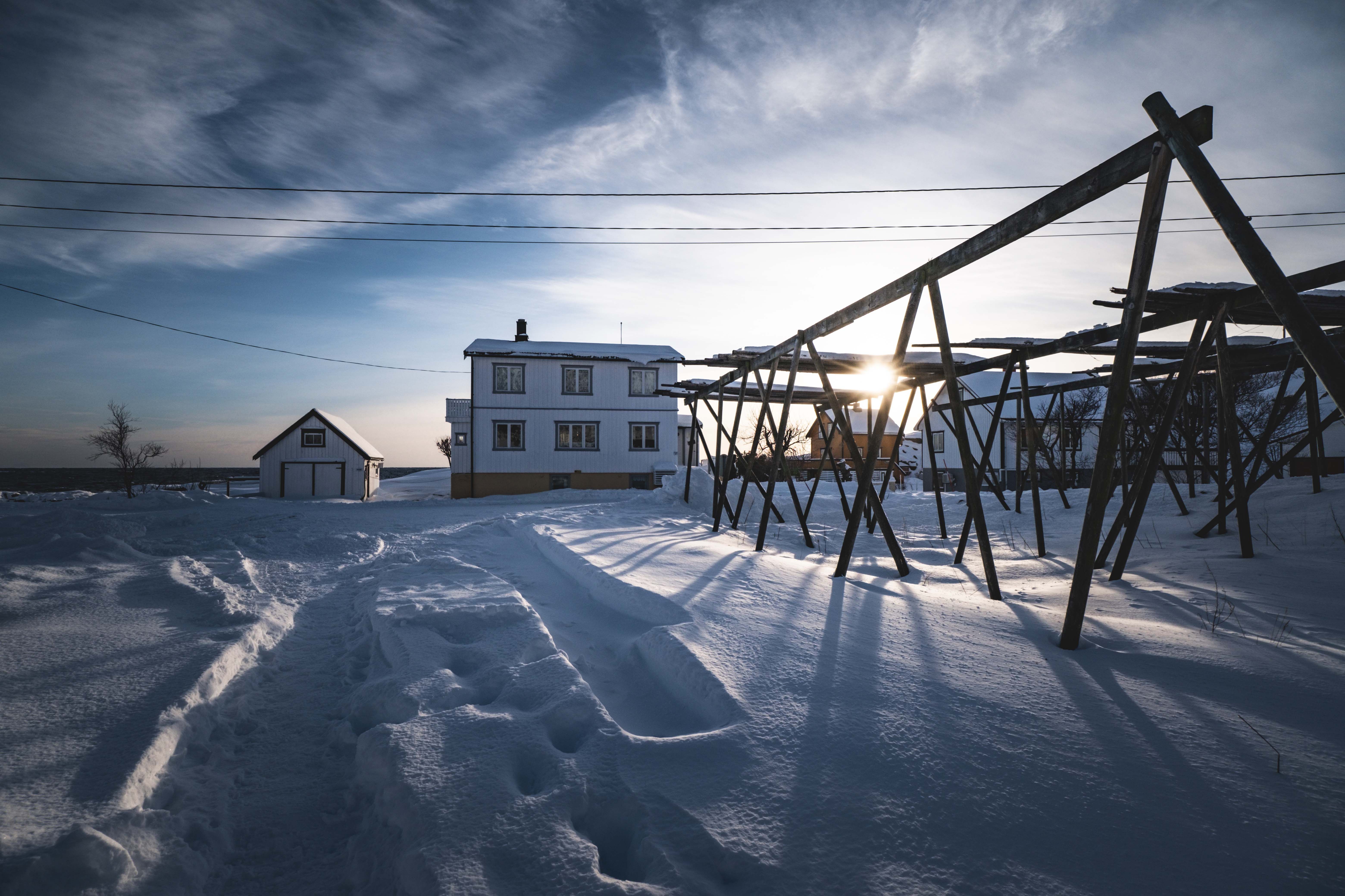Charming Snow-Covered House in Winter Sunset · Free Stock Photo