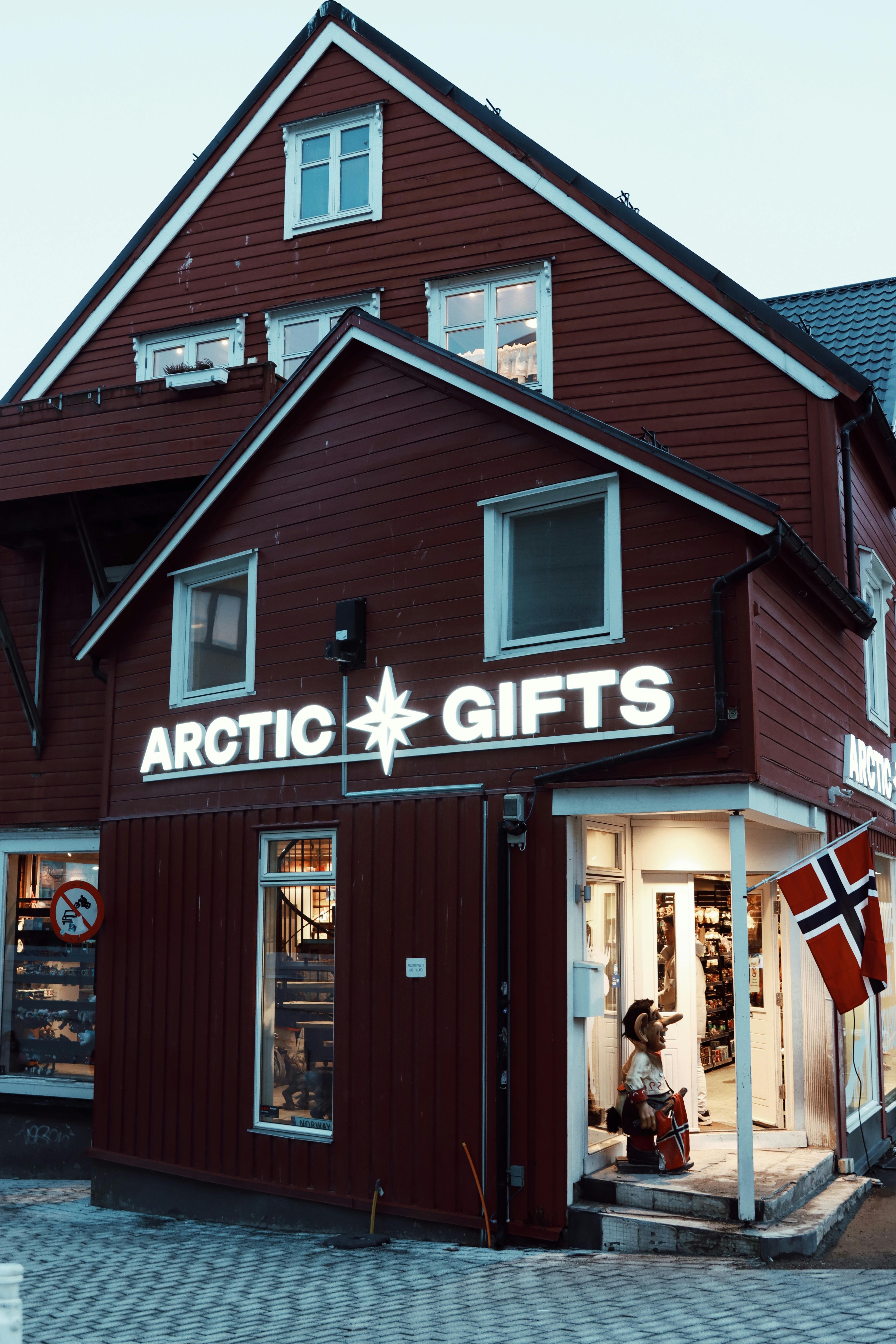 Red Wooden Arctic Gifts Storefront in Tromsø · Free Stock Photo