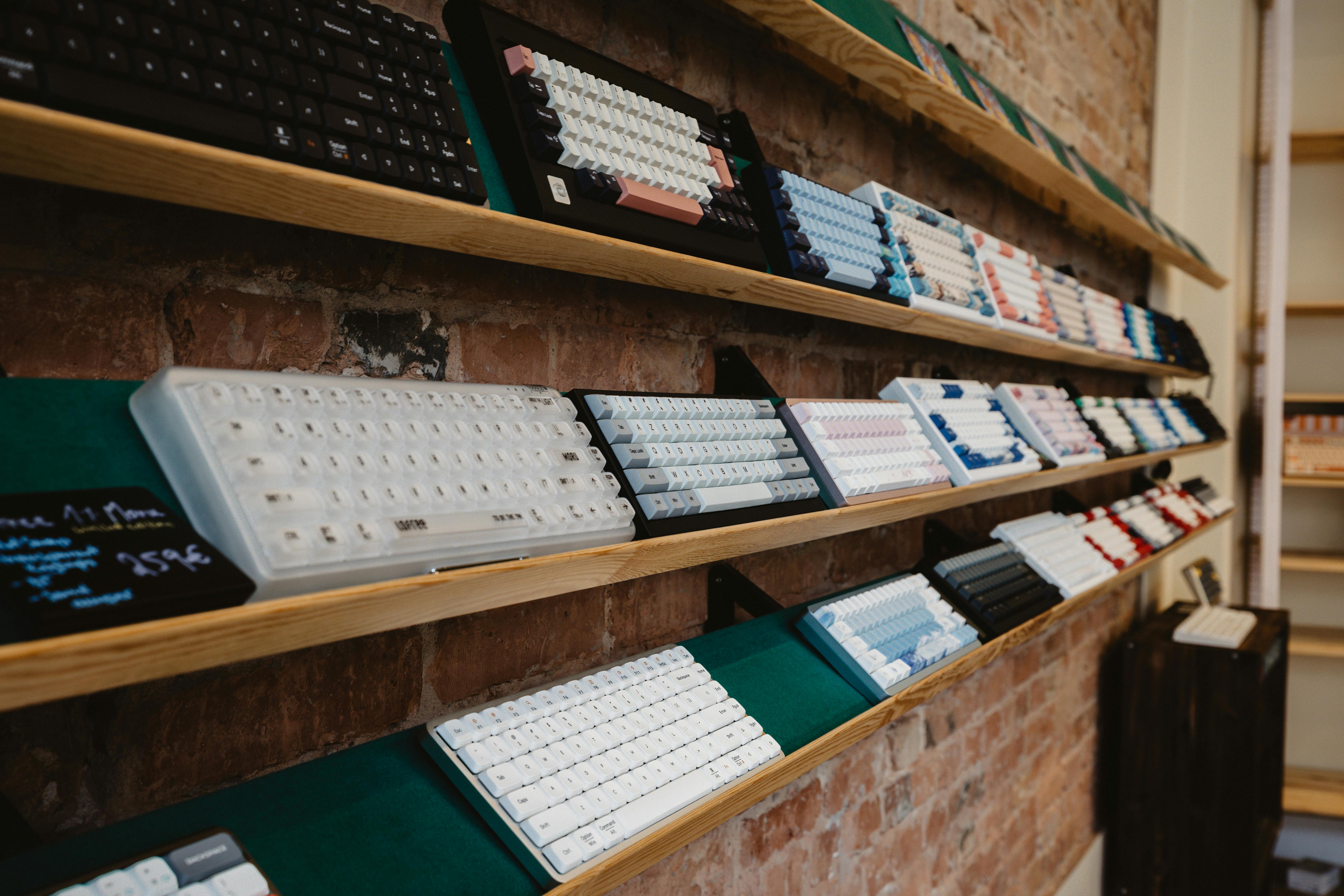 Colorful Mechanical Keyboards on Display Shelf · Free Stock Photo