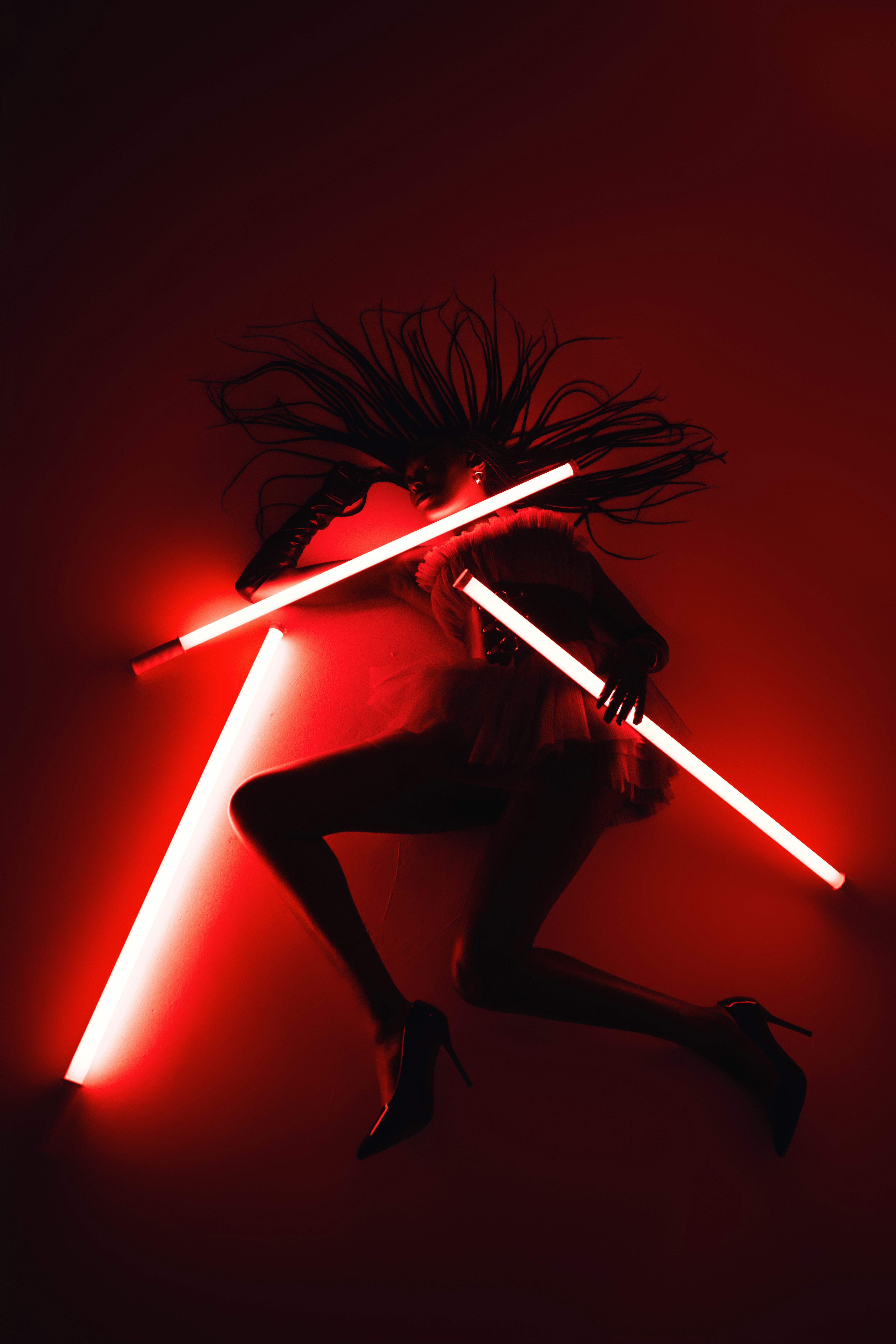 Dramatic Fashion Model with Neon Light Strips · Free Stock Photo