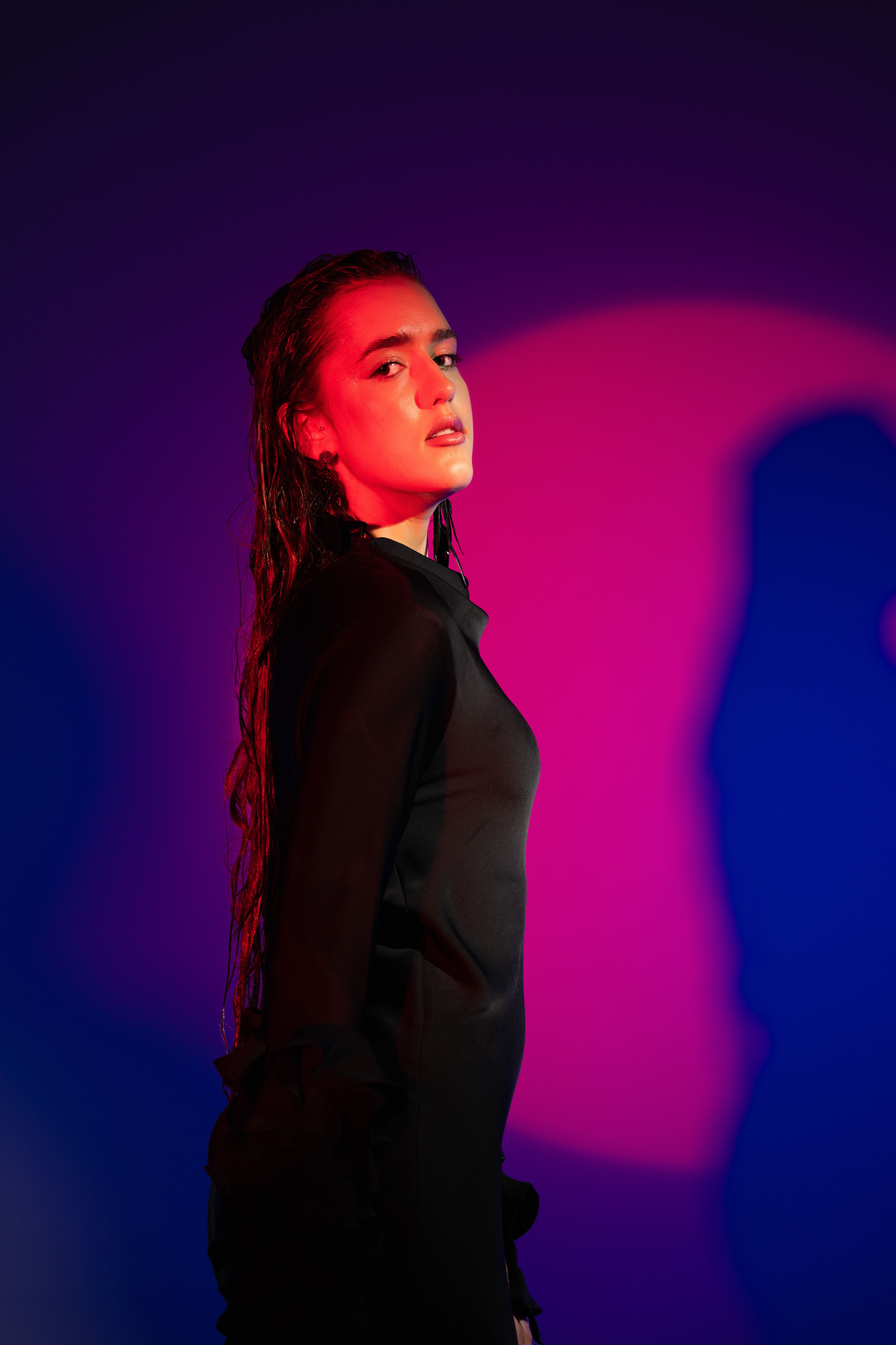 Moody Fashion Portrait with Vibrant Lighting · Free Stock Photo