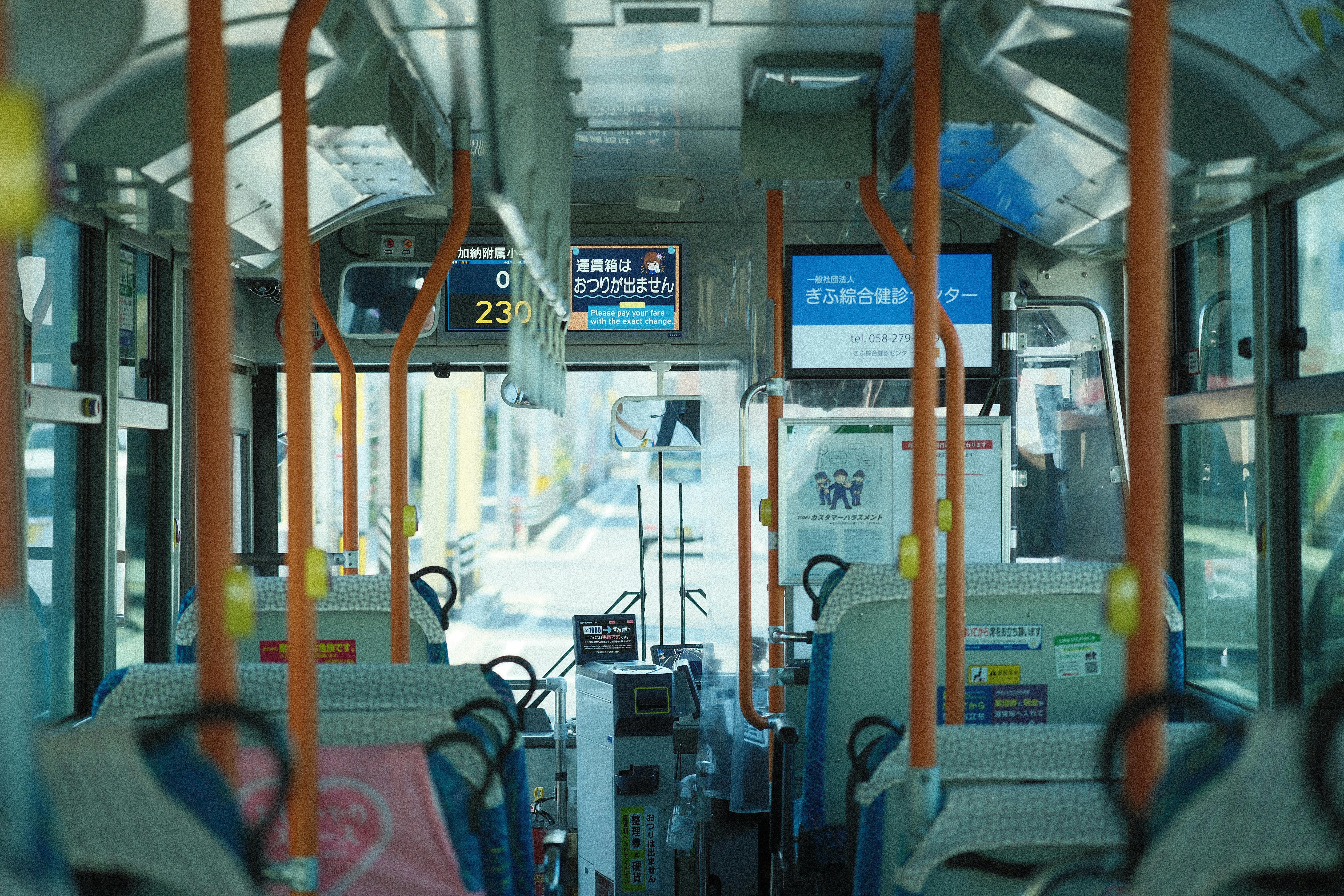 Interior of Urban Bus with Empty Seats and Fare Display · Free Stock Photo