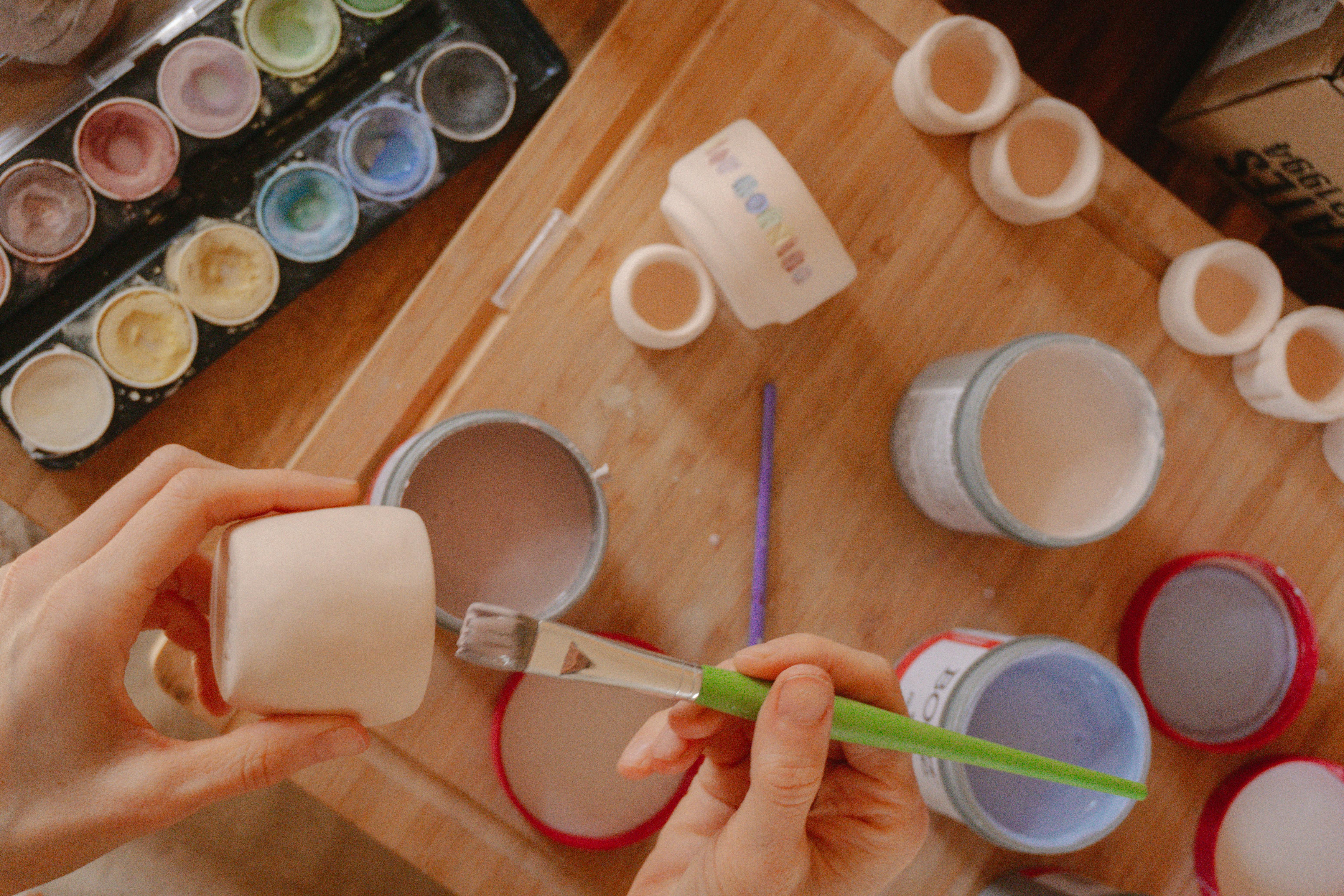 Creative Pottery Painting with Pastel Colors · Free Stock Photo