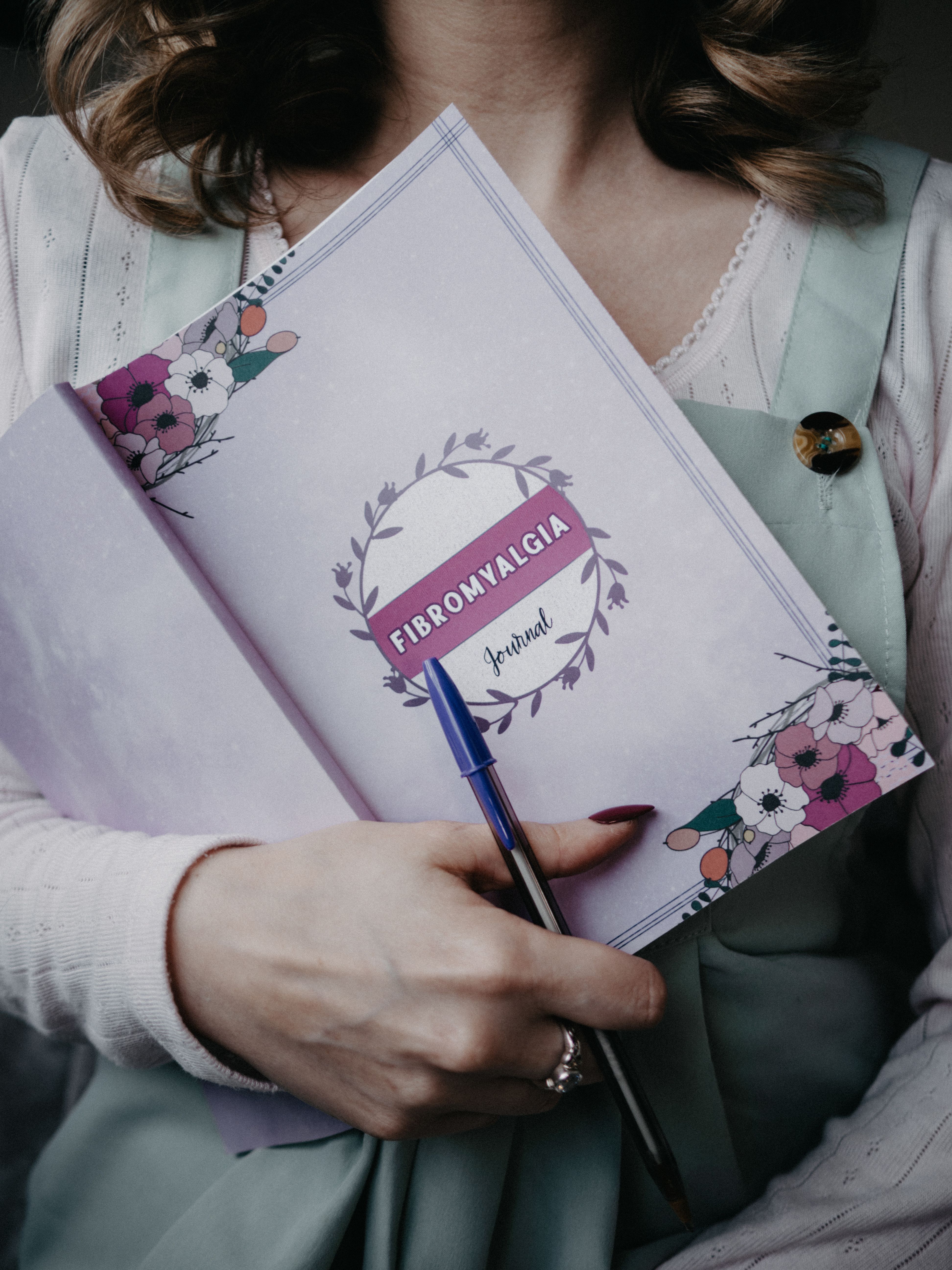 Woman Holding Fibromyalgia Awareness Journal · Free Stock Photo