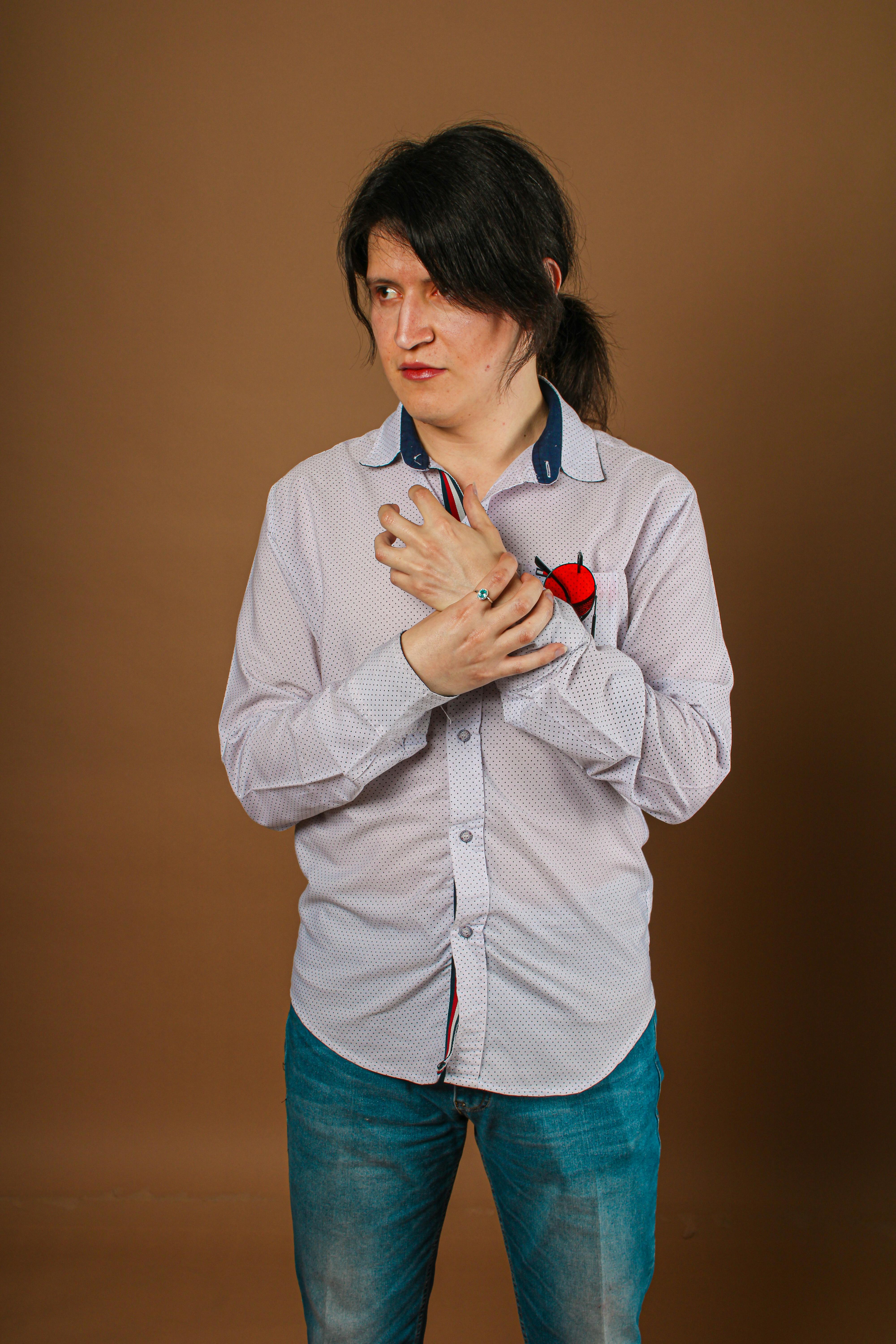 Contemplative Person Holding Heart Symbol in Studio · Free Stock Photo