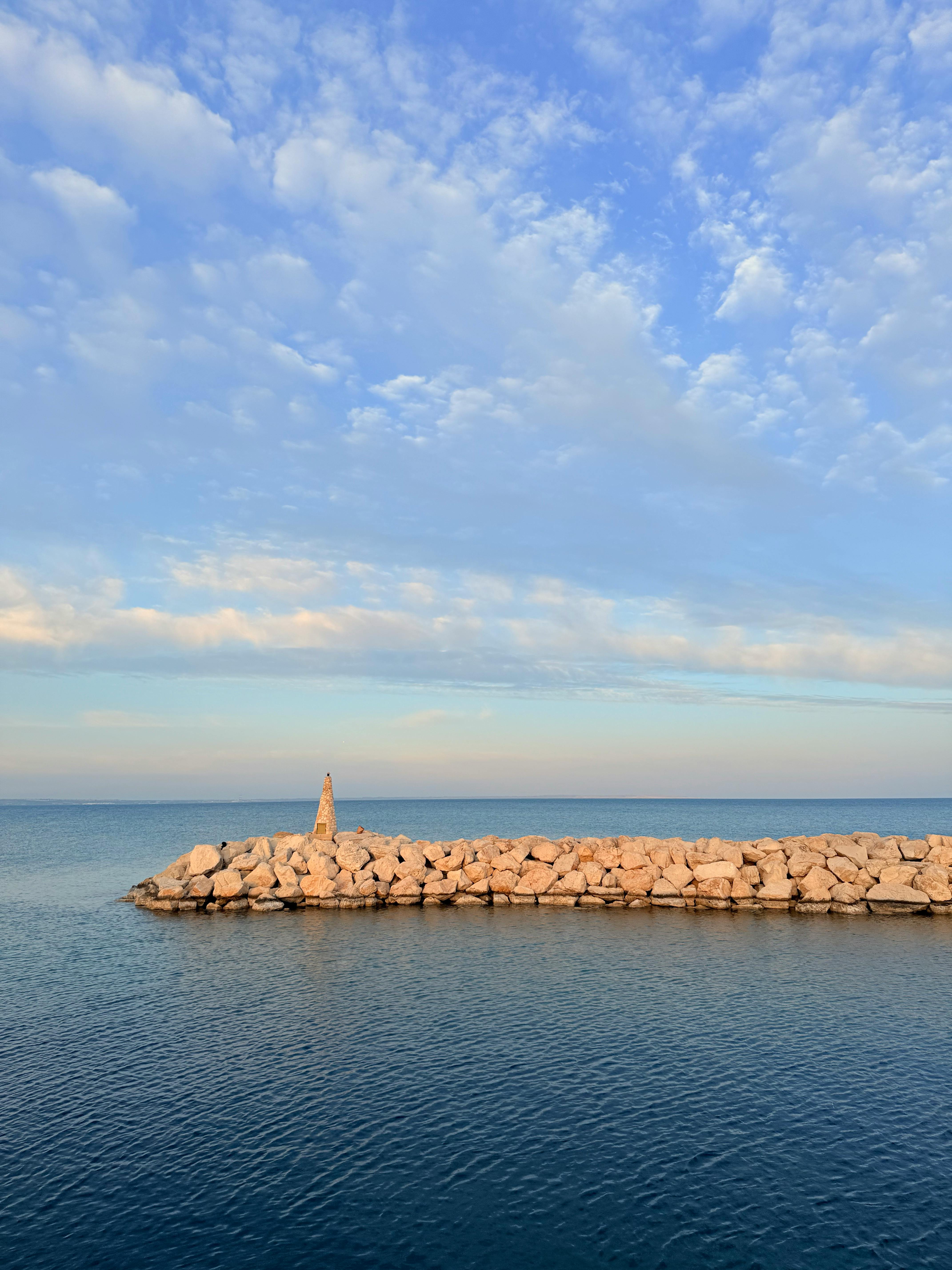 Tranquil Seascape with Rocky Pier in Cyprus · Free Stock Photo