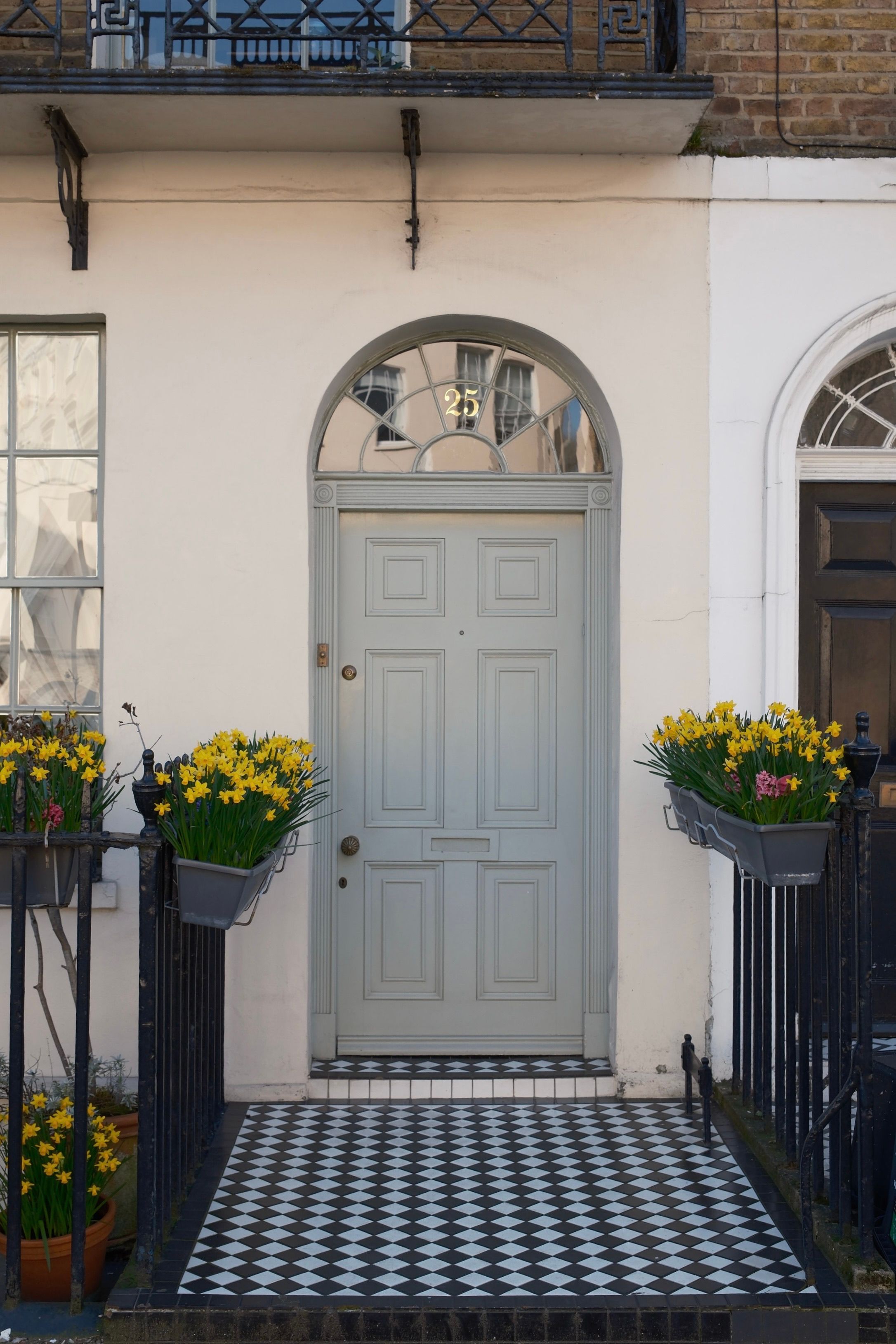 Elegant Townhouse Front Door with Spring Flowers · Free Stock Photo