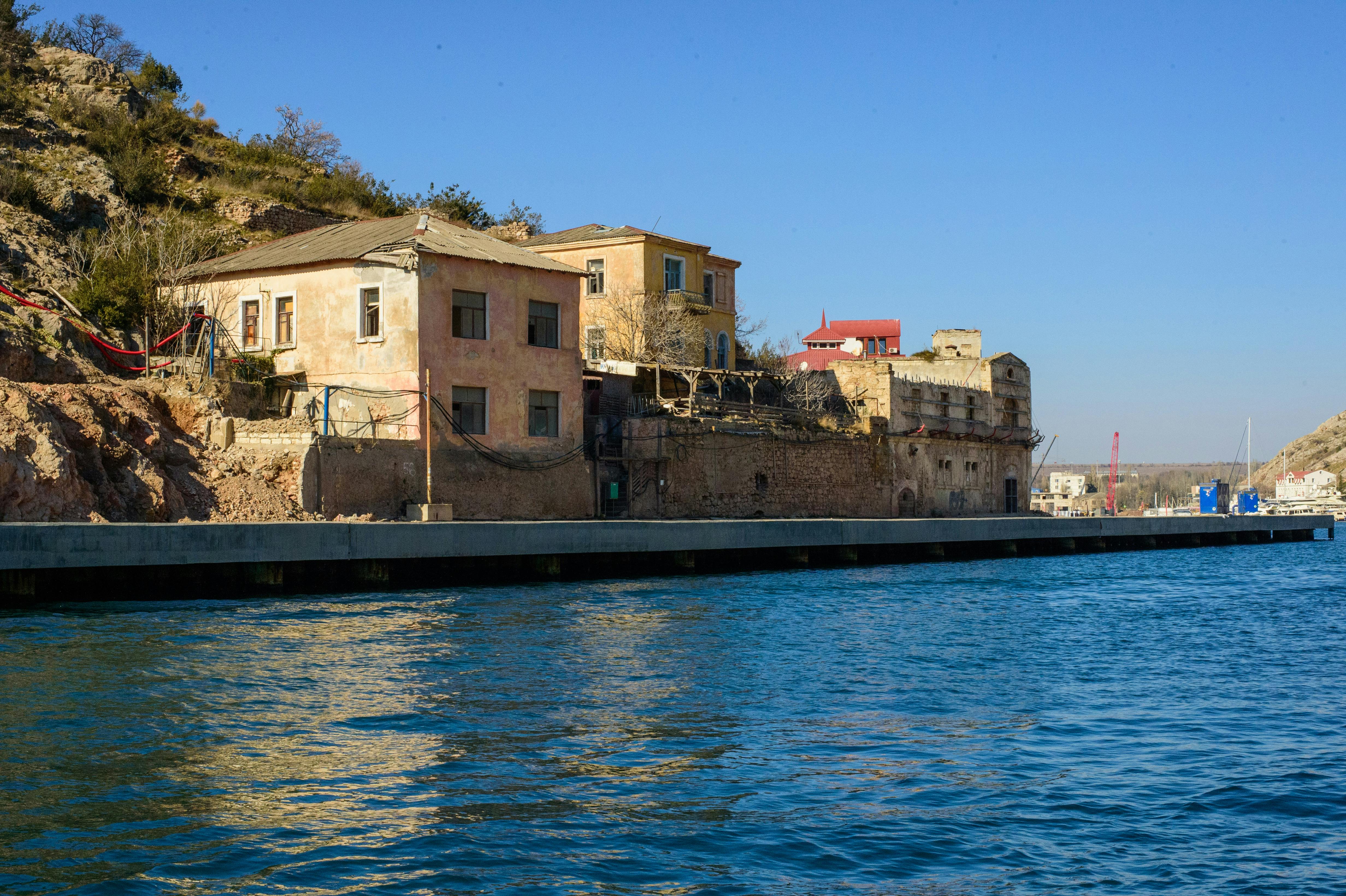Old Stone Building by the Seaside Waterfront · Free Stock Photo