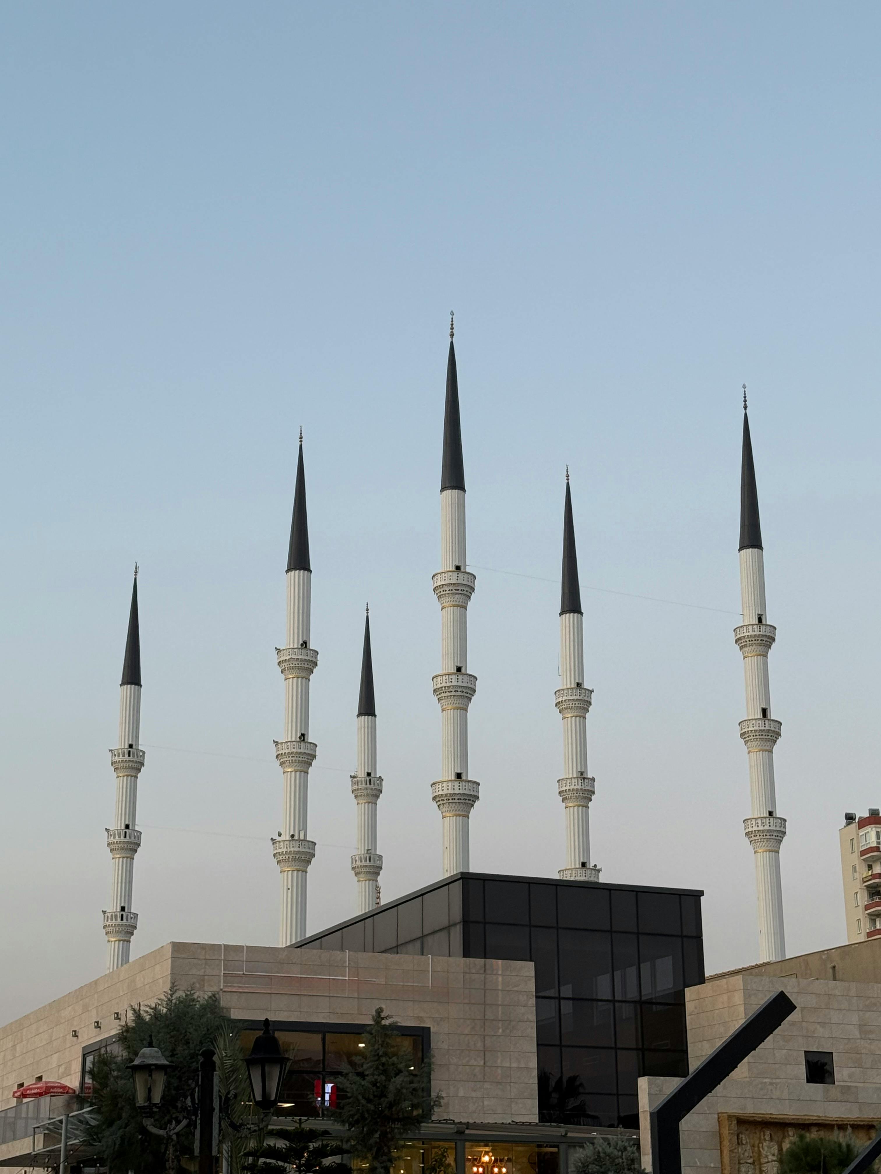 Tall Minarets of a Mosque Against Clear Sky · Free Stock Photo