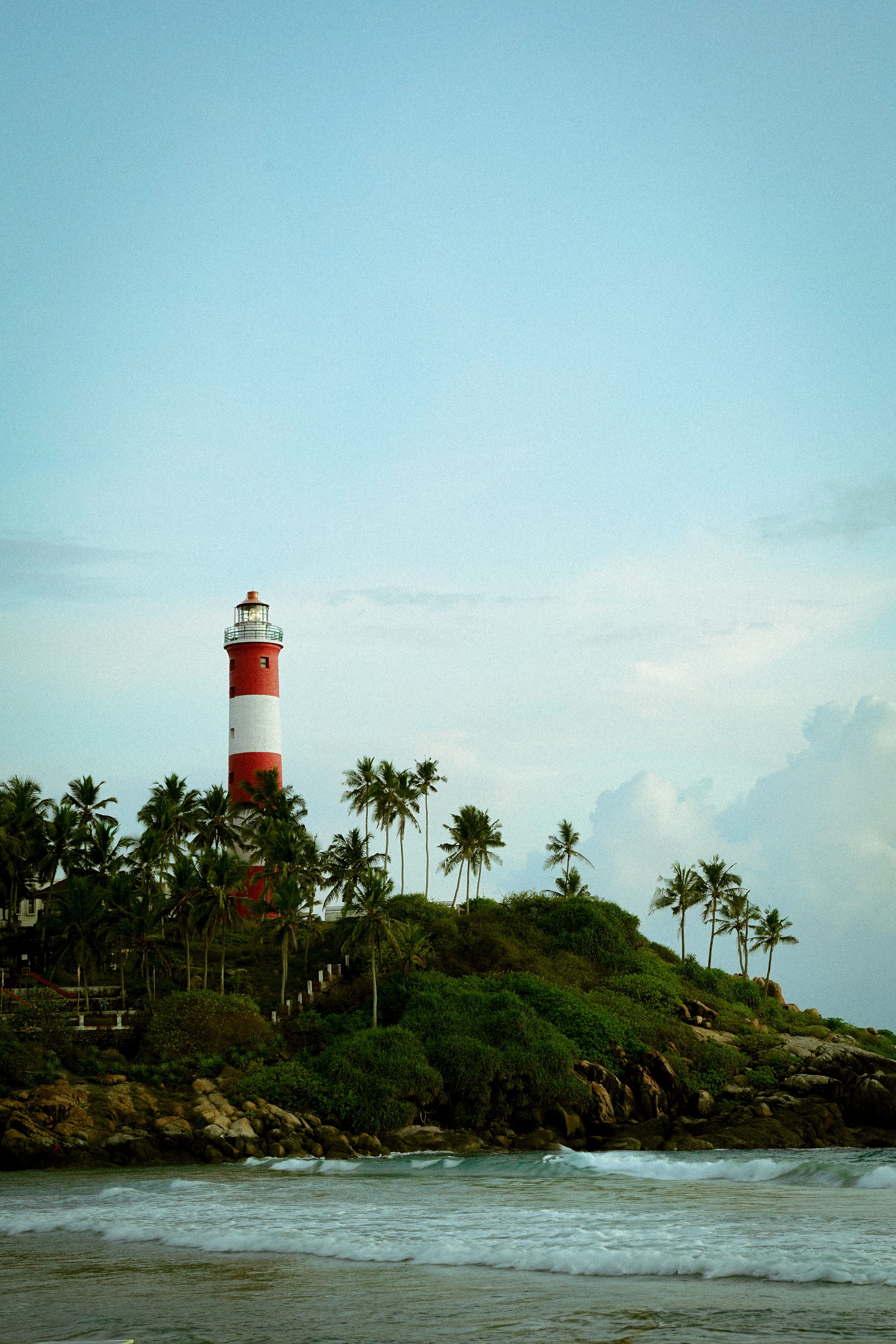Scenic Lighthouse on Tropical Island Shore · Free Stock Photo