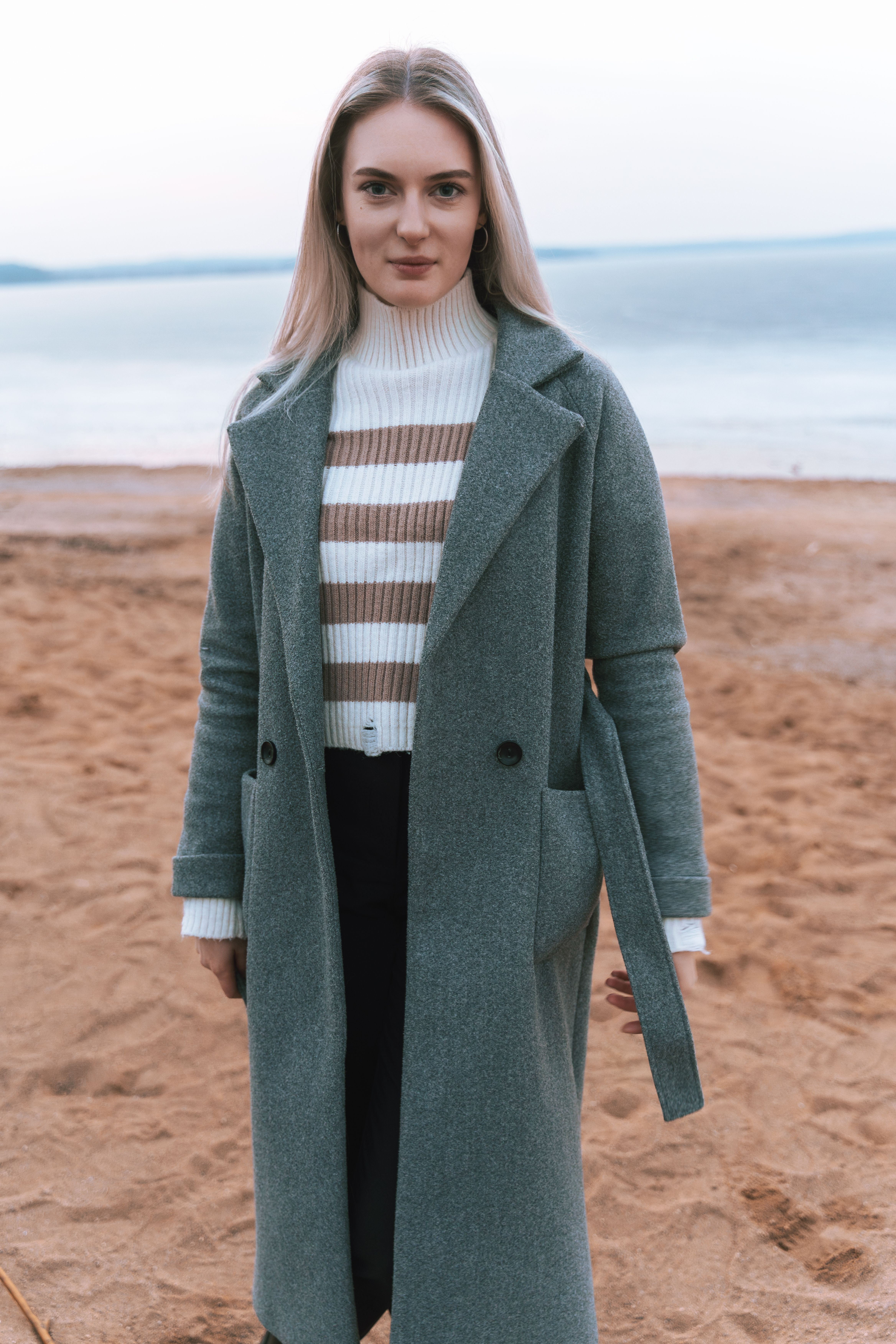 Stylish Woman in Winter Coat on a Beach · Free Stock Photo