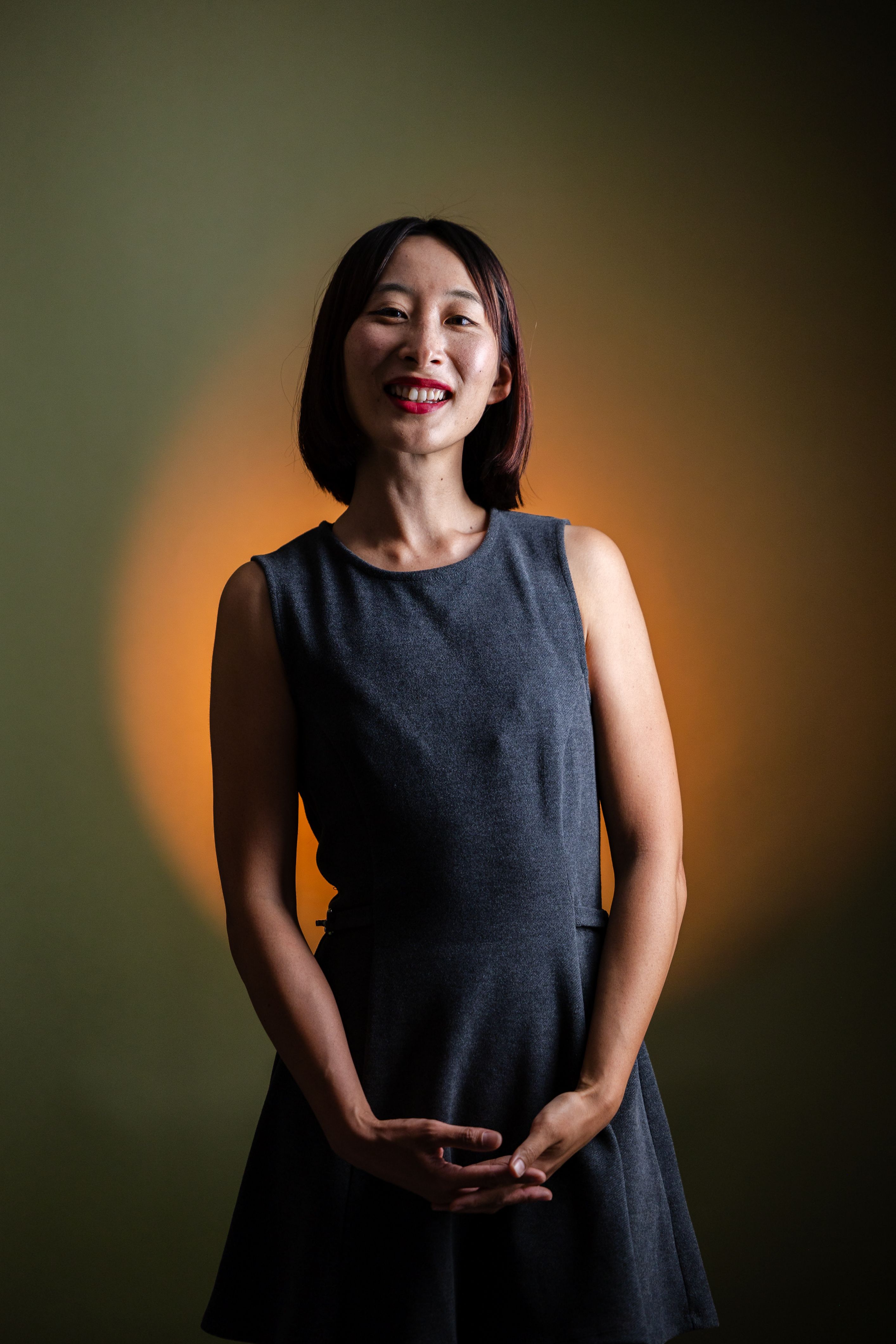 Portrait of a Smiling Woman in Studio Lighting · Free Stock Photo