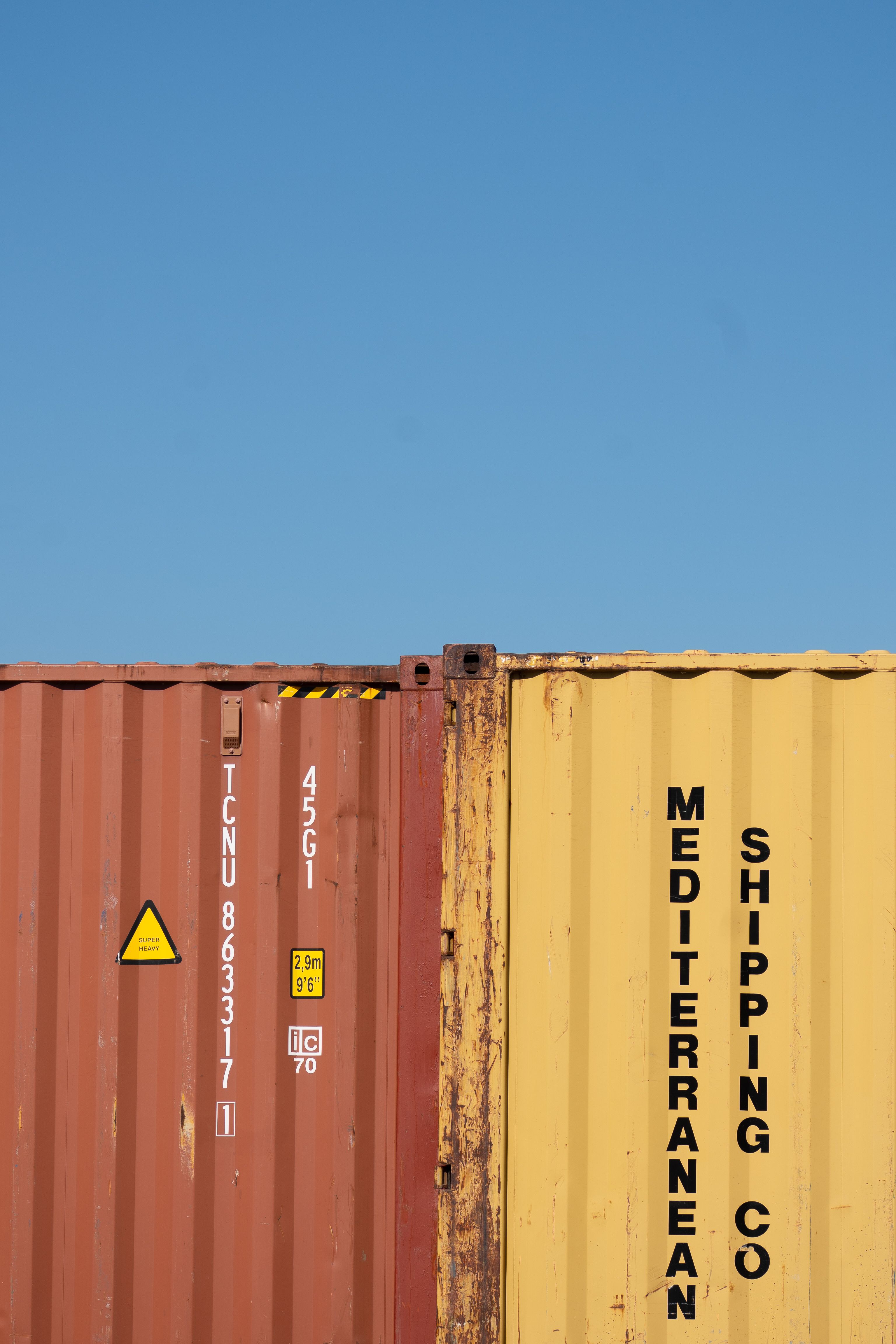 Colorful Shipping Containers Under Blue Sky · Free Stock Photo