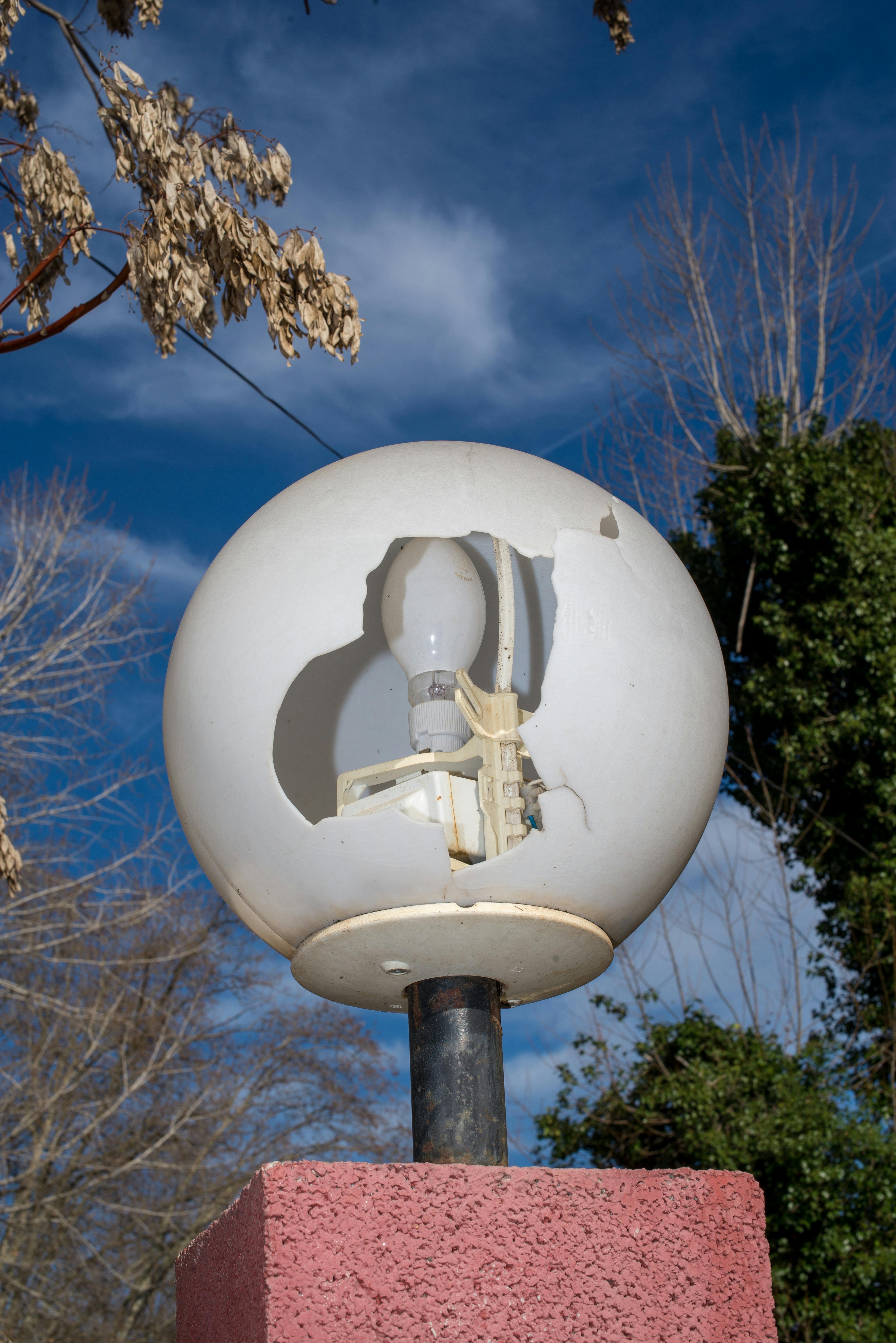 Broken Outdoor Lamp Against Blue Sky · Free Stock Photo