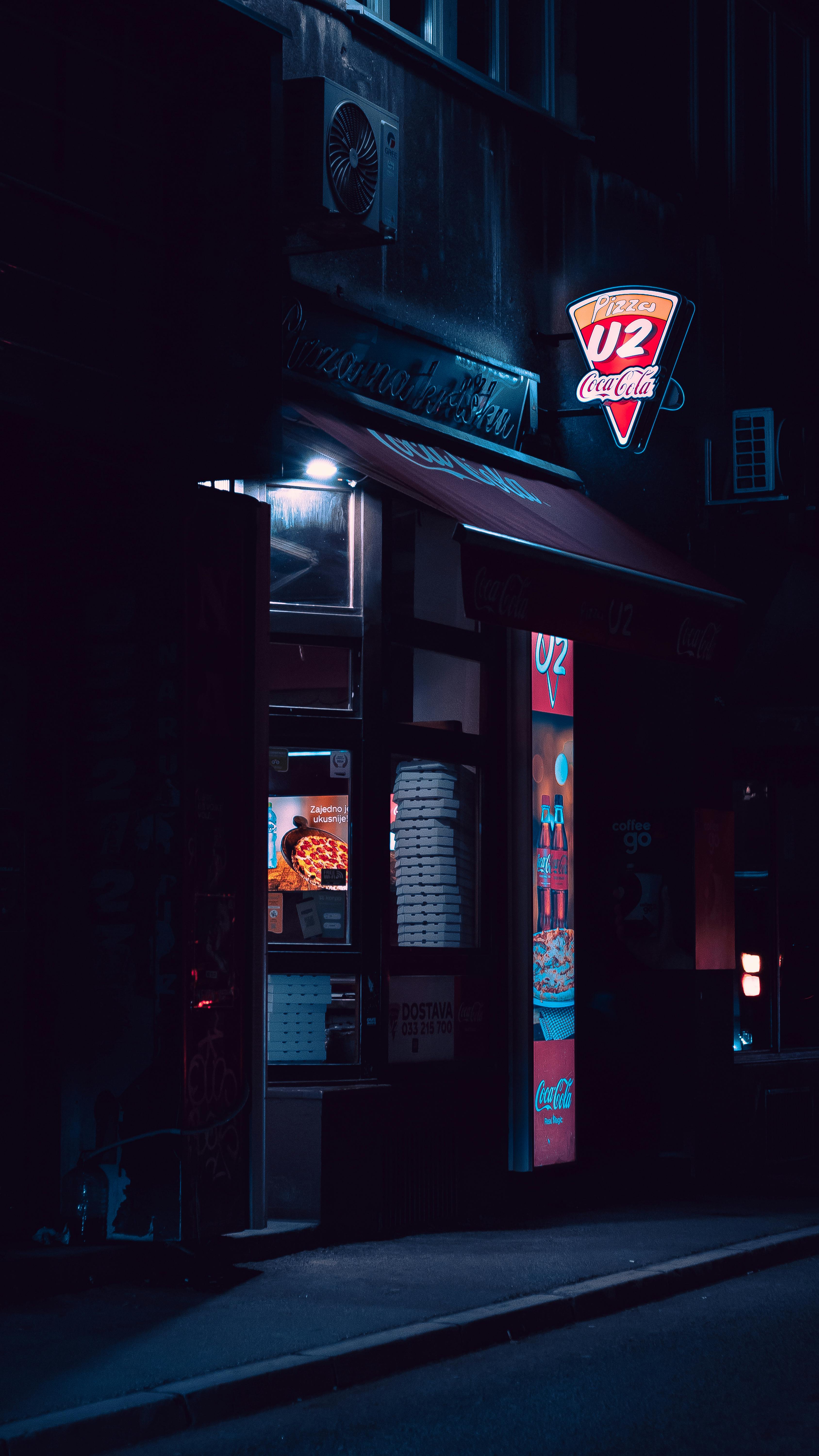Moody Nighttime Pizza Shop with Neon Lights · Free Stock Photo