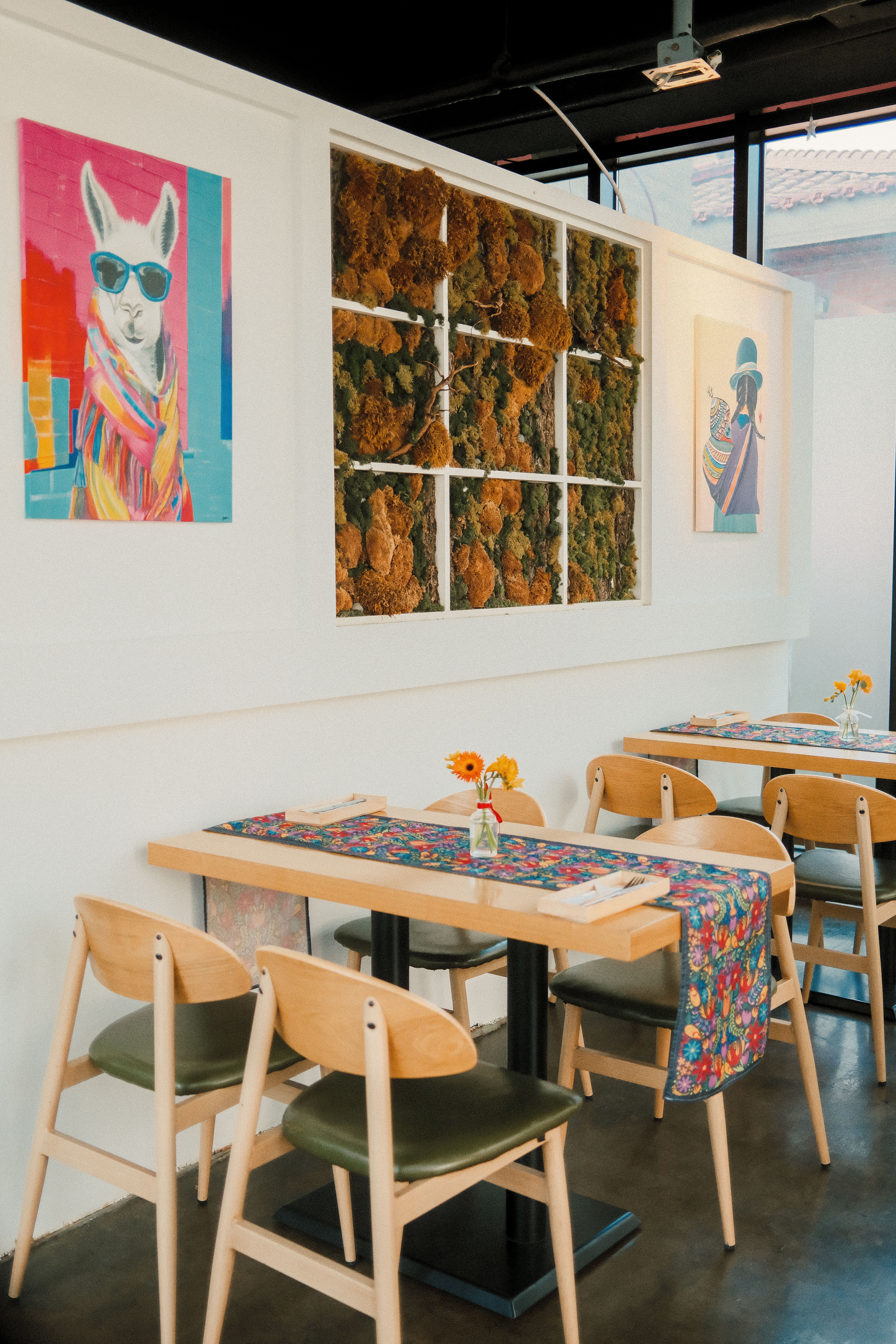 Modern Cafe Interior with Vibrant Artwork · Free Stock Photo