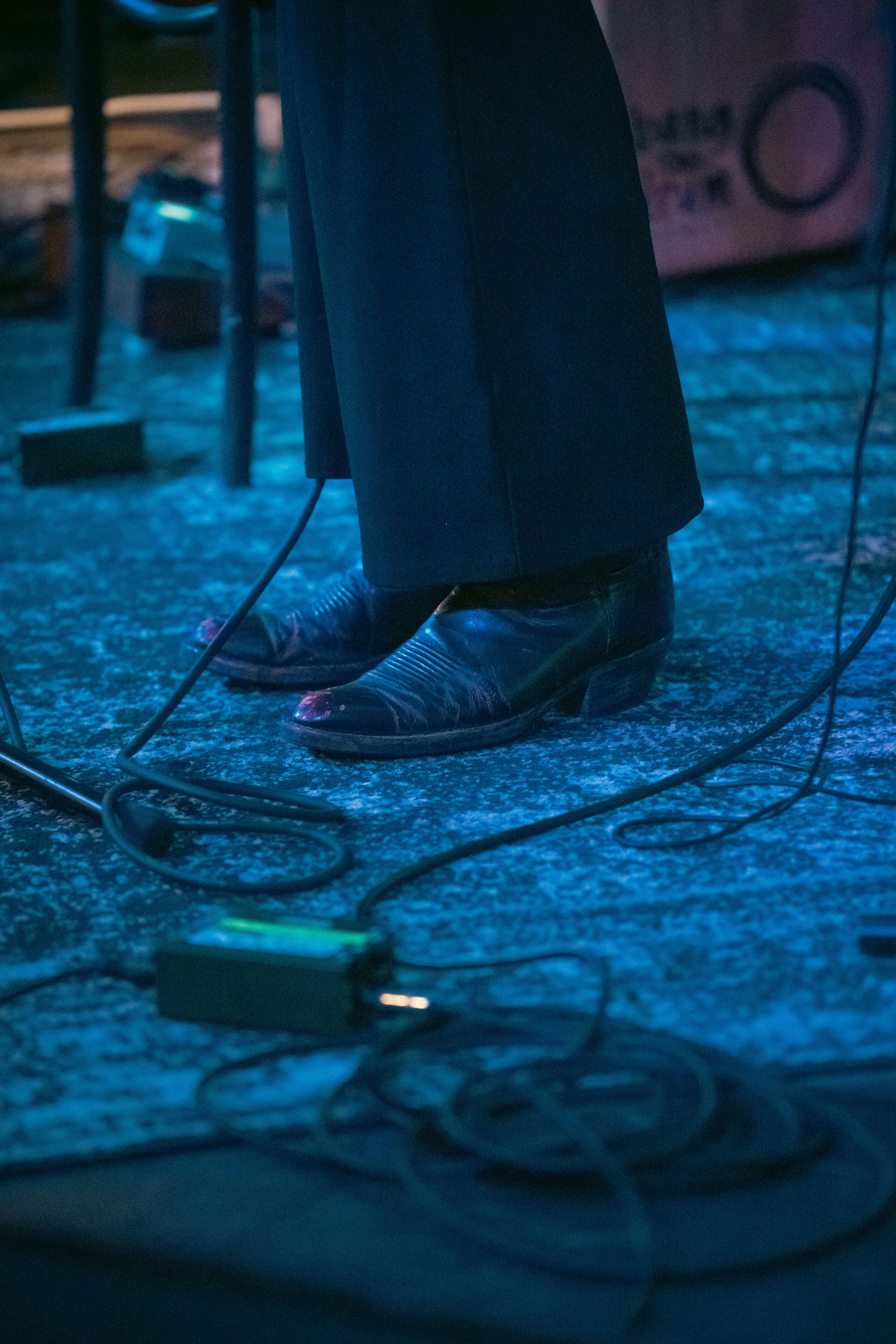 Close-Up of Musician's Feet on Stage · Free Stock Photo