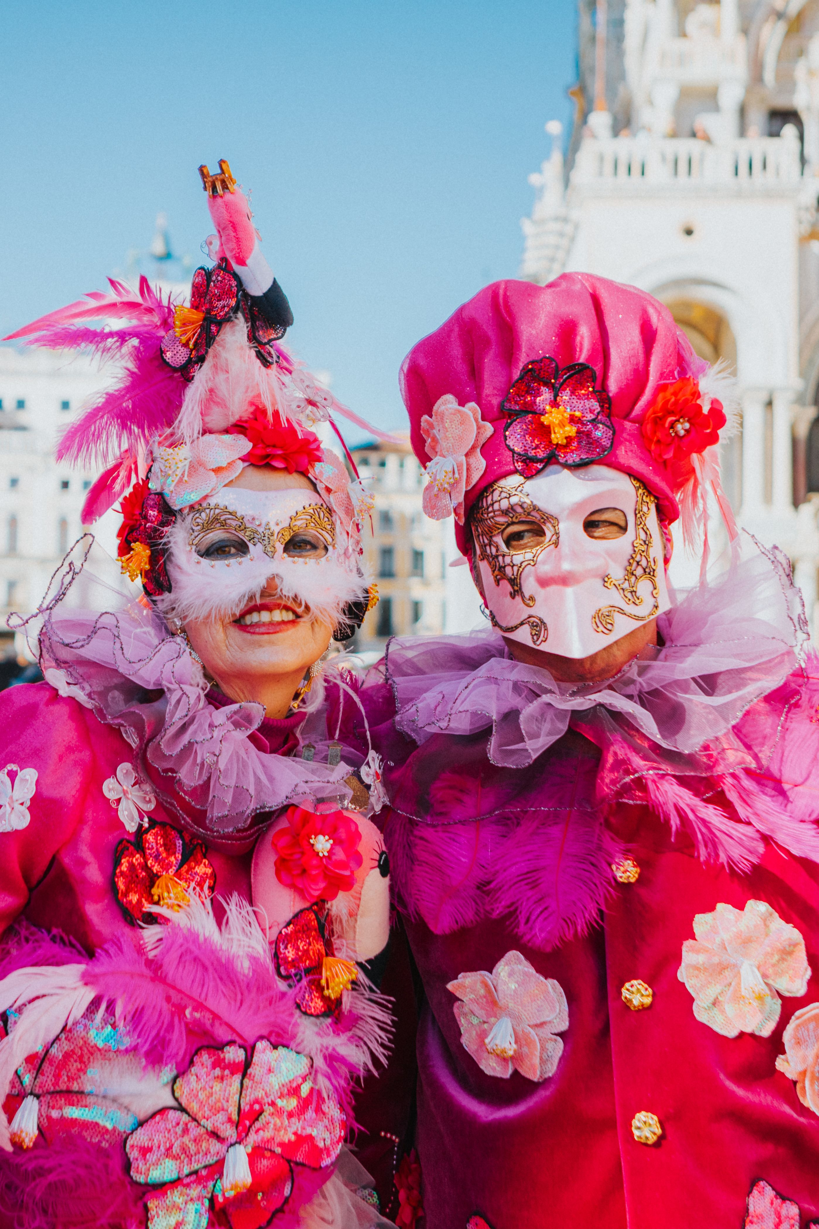 Venetian Carnival Masks in Vivid Pink Attire · Free Stock Photo