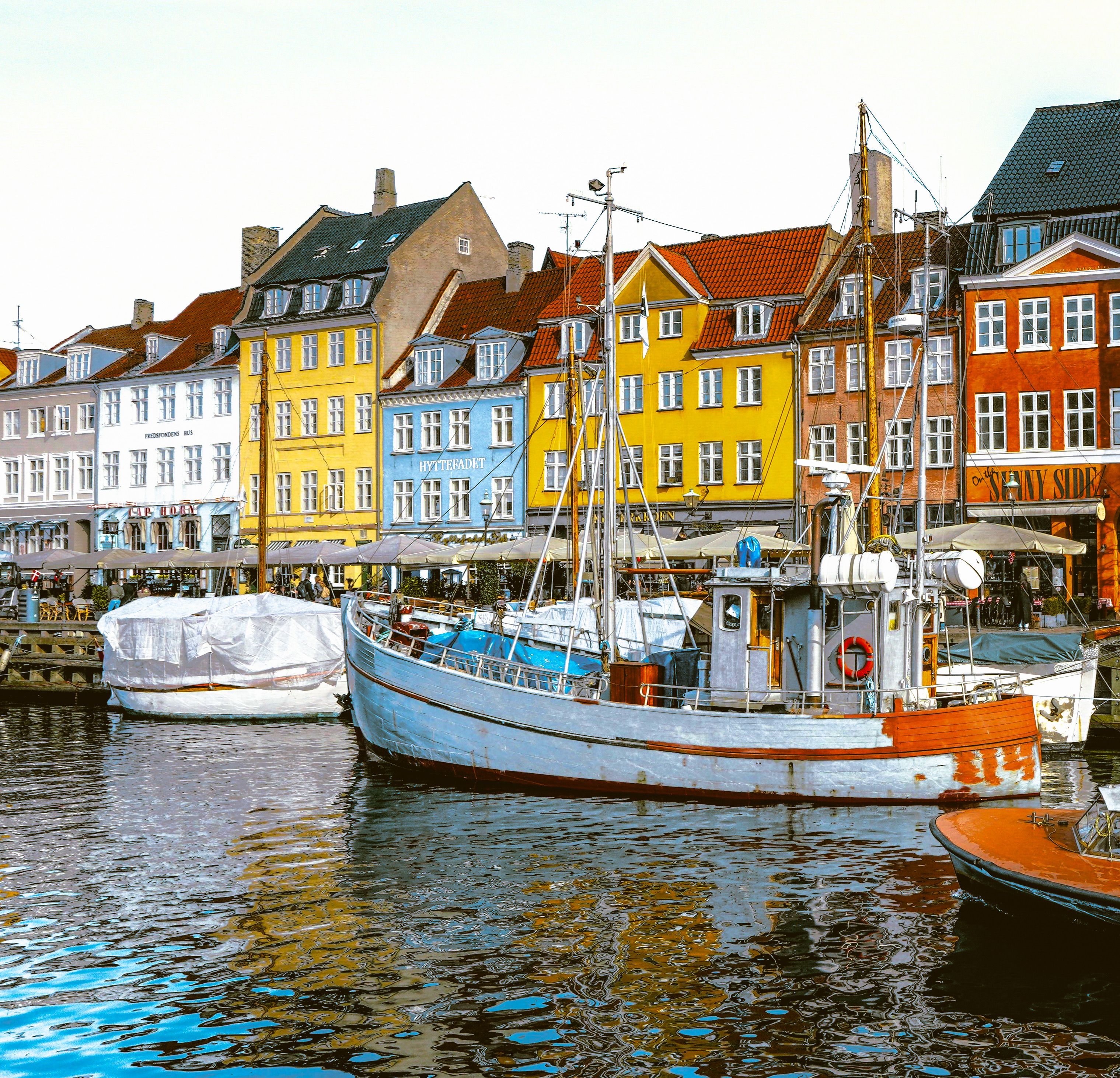 Colorful Nyhavn waterfront with boats in Copenhagen Denmark · Free ...