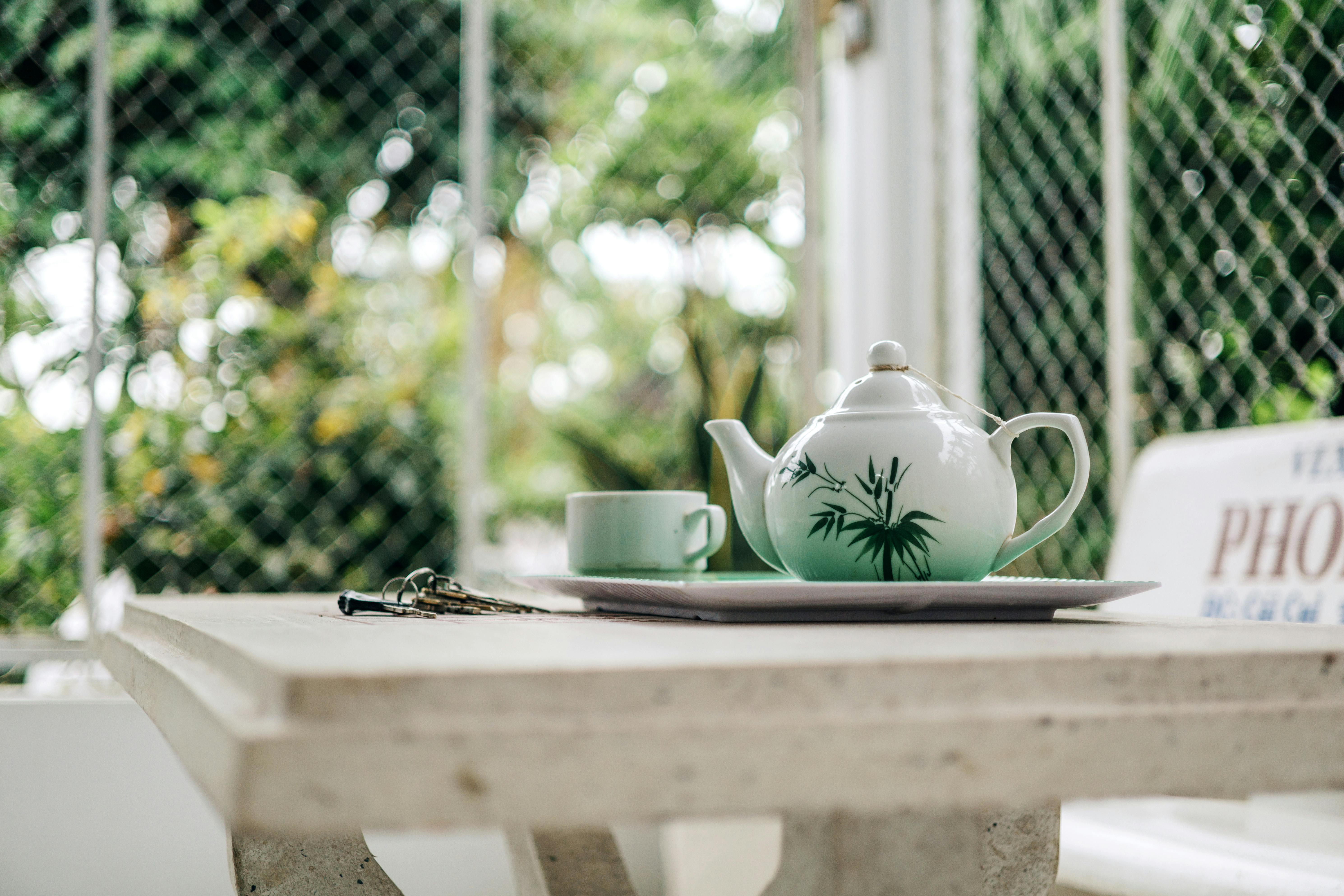 Teapot Beside Cup on Table · Free Stock Photo