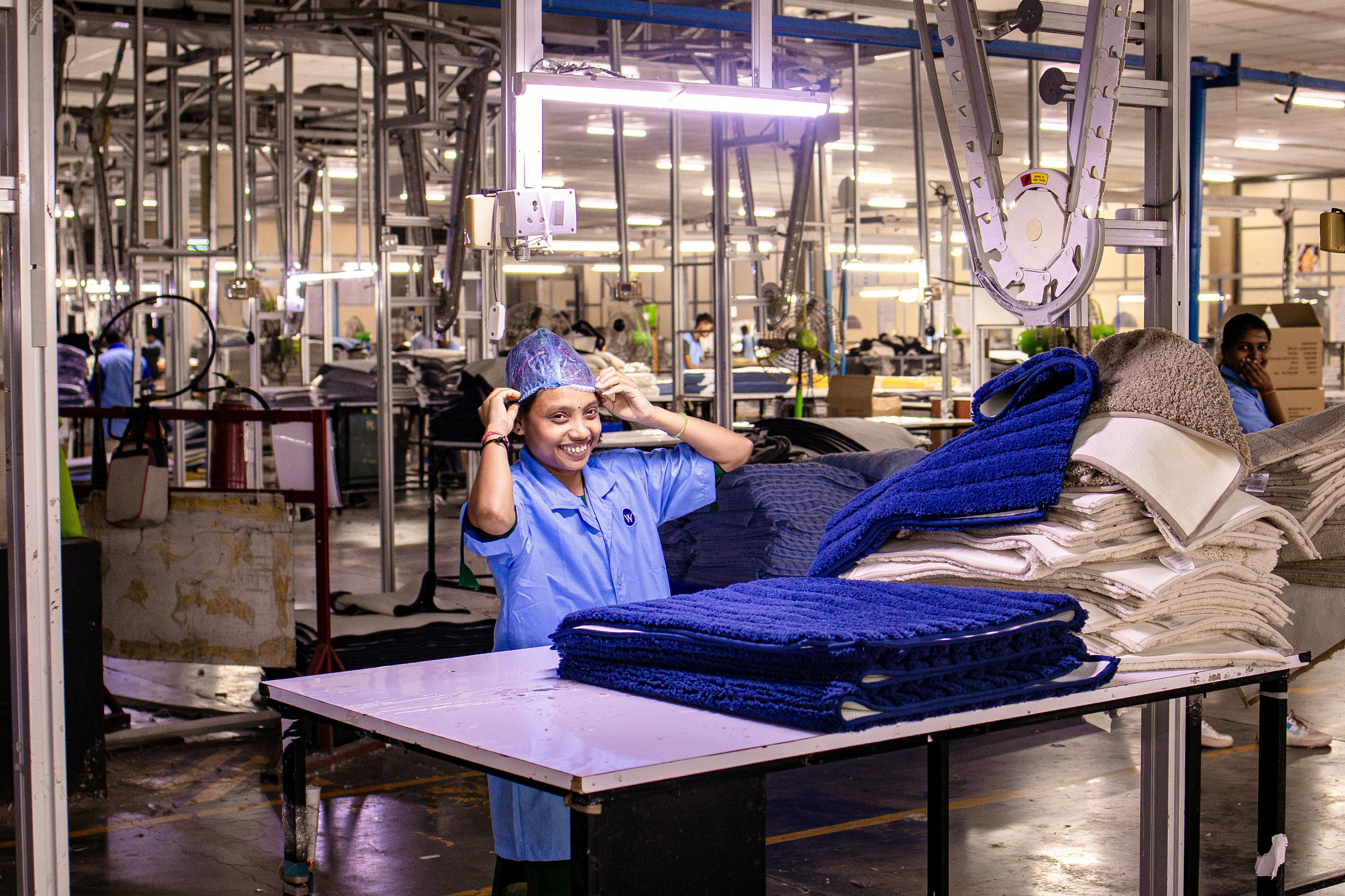 Smiling Factory Worker in Textile Industry · Free Stock Photo