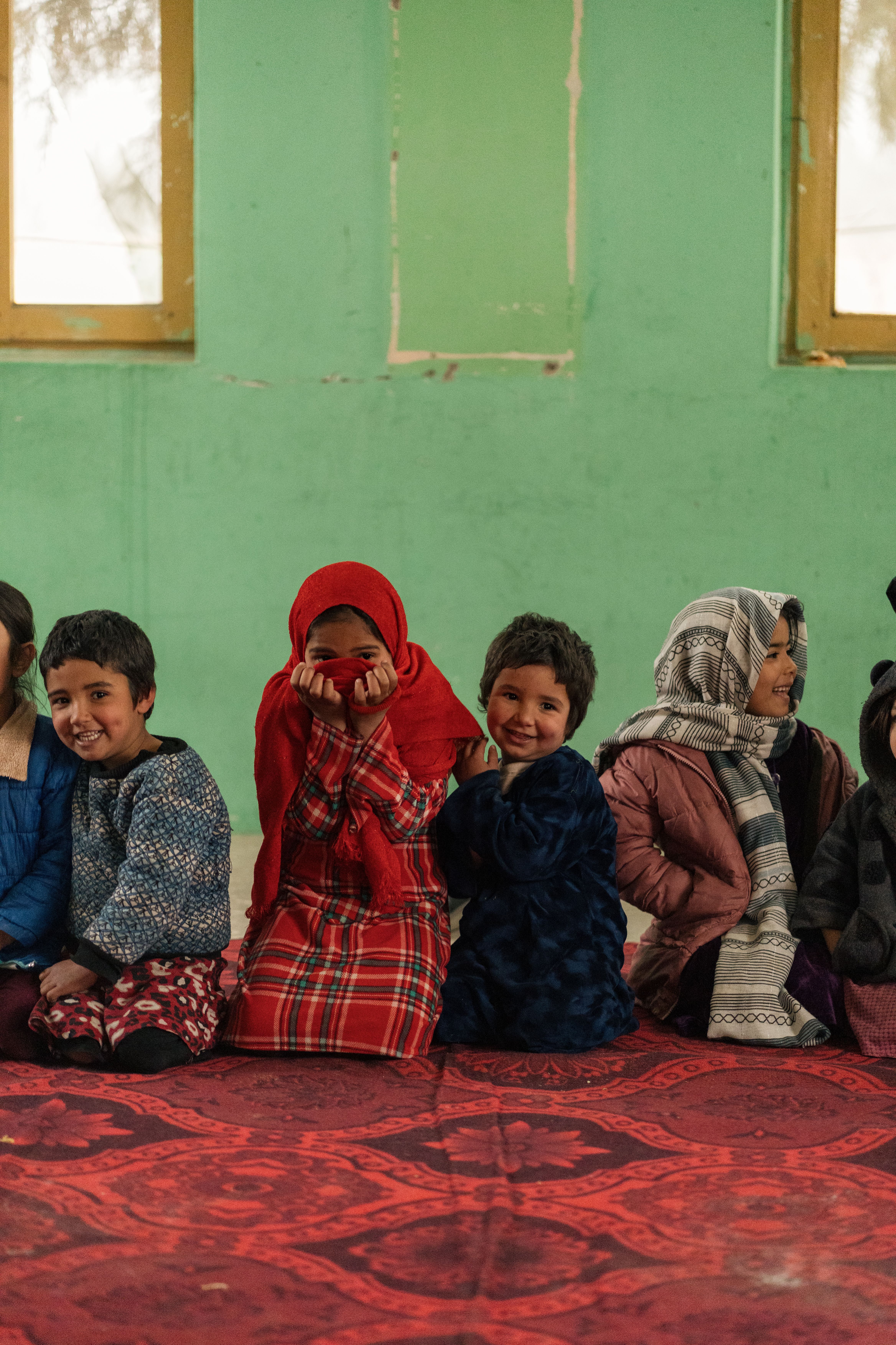 Children Sitting Together in Afghan Cultural Attire · Free Stock Photo