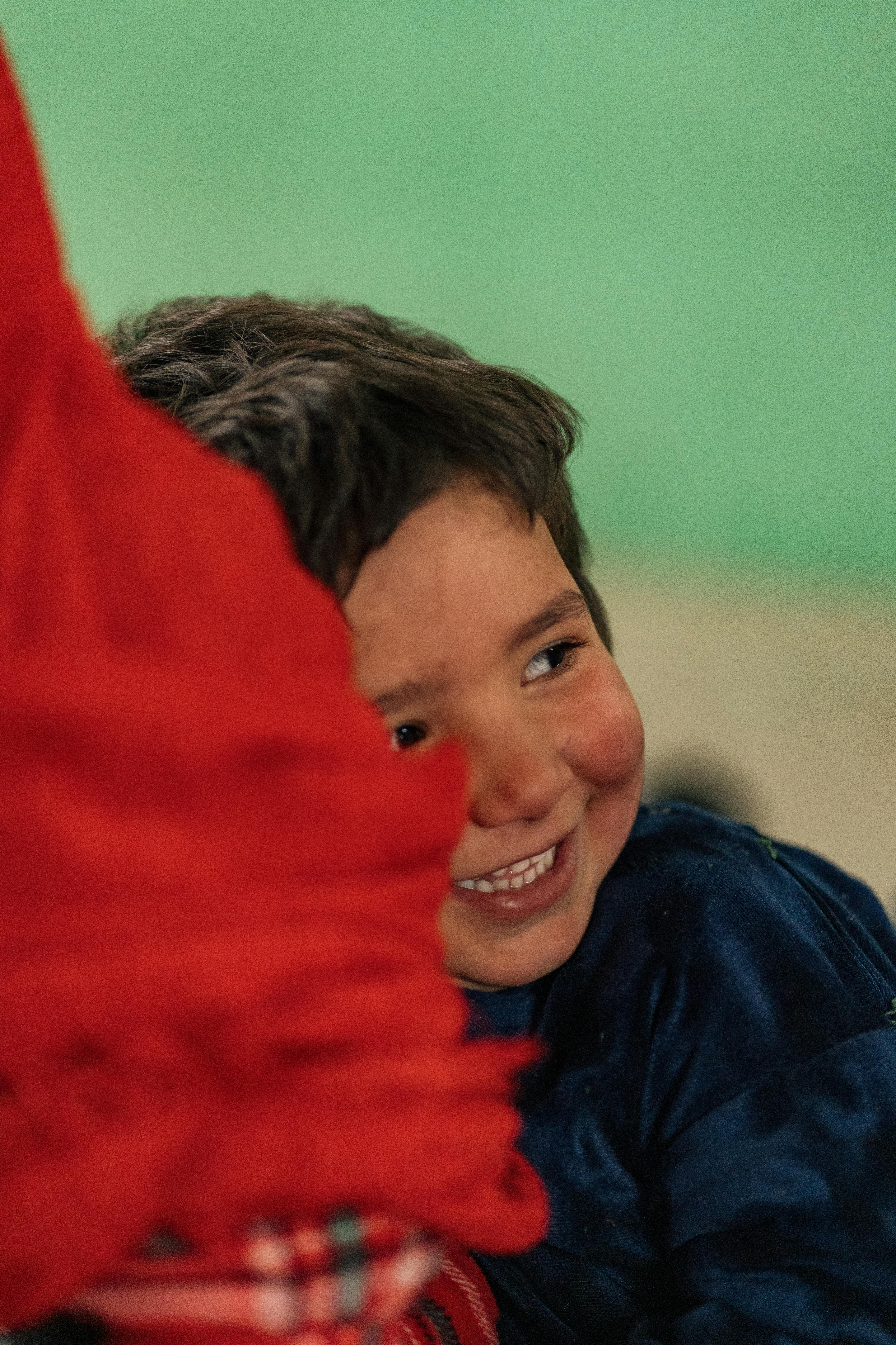 Smiling Afghan Child in Vibrant Clothing · Free Stock Photo