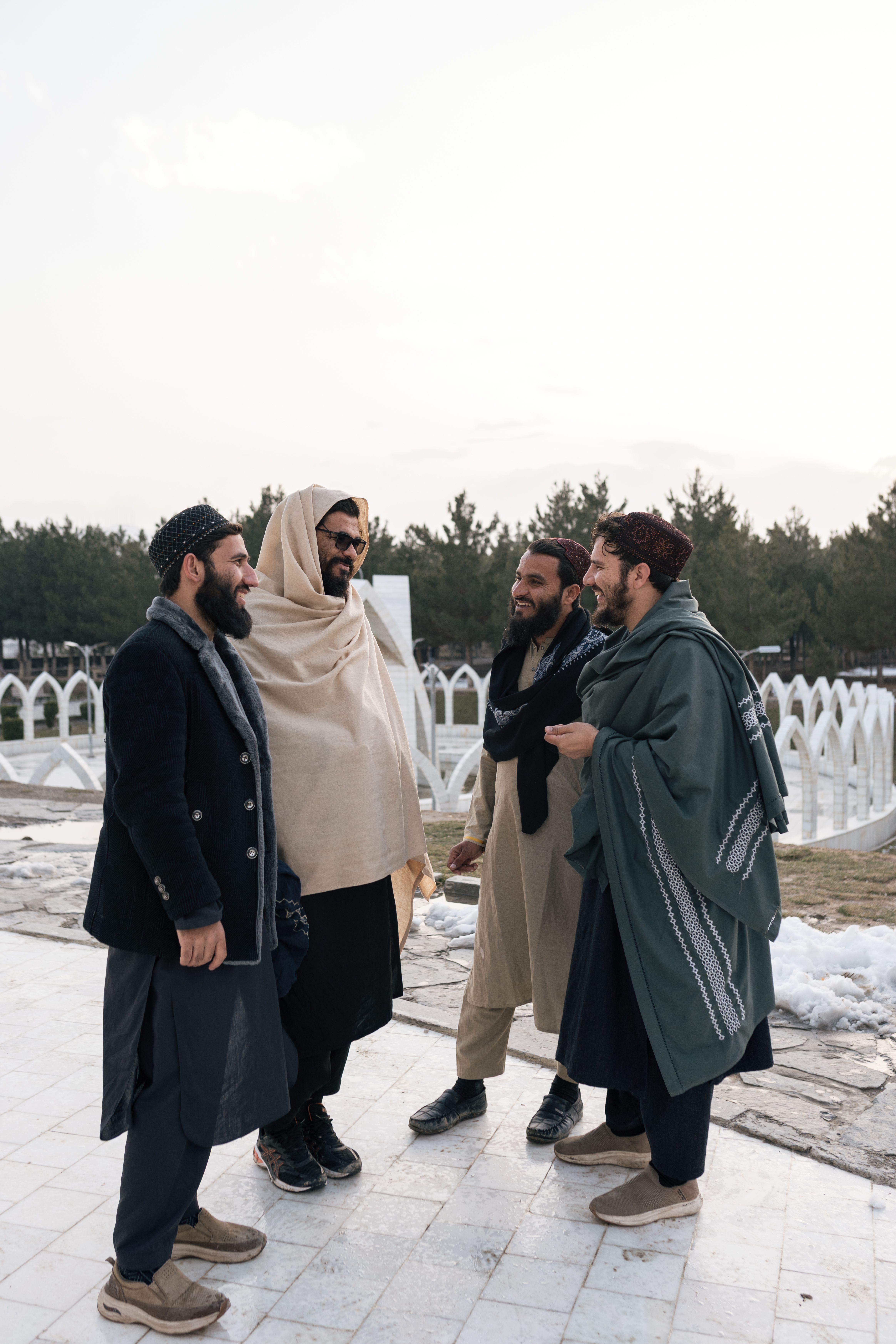 Afghan Men in Traditional Attire Outdoors · Free Stock Photo