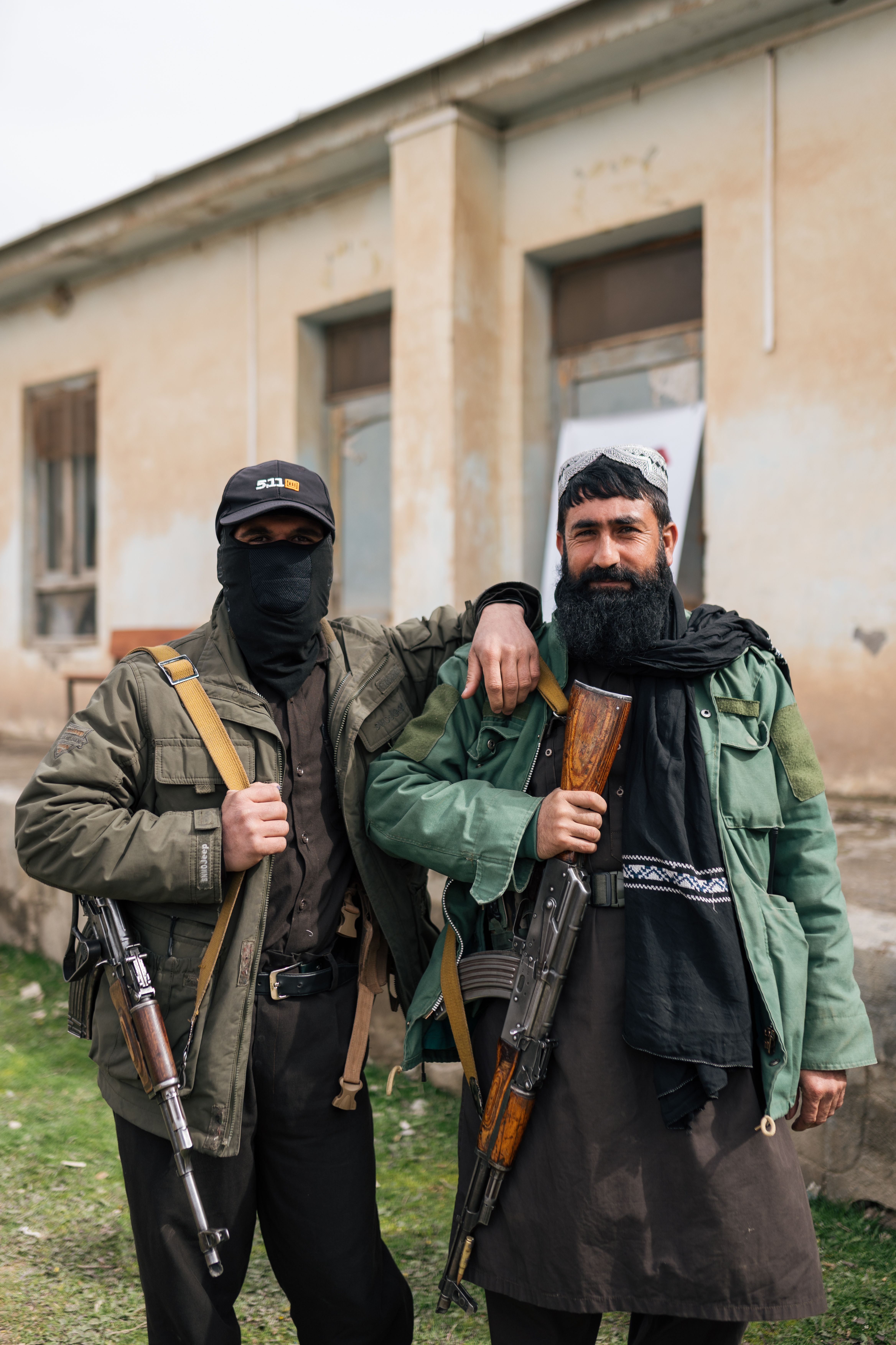 Armed Men Posing Outside Building in Afghanistan · Free Stock Photo