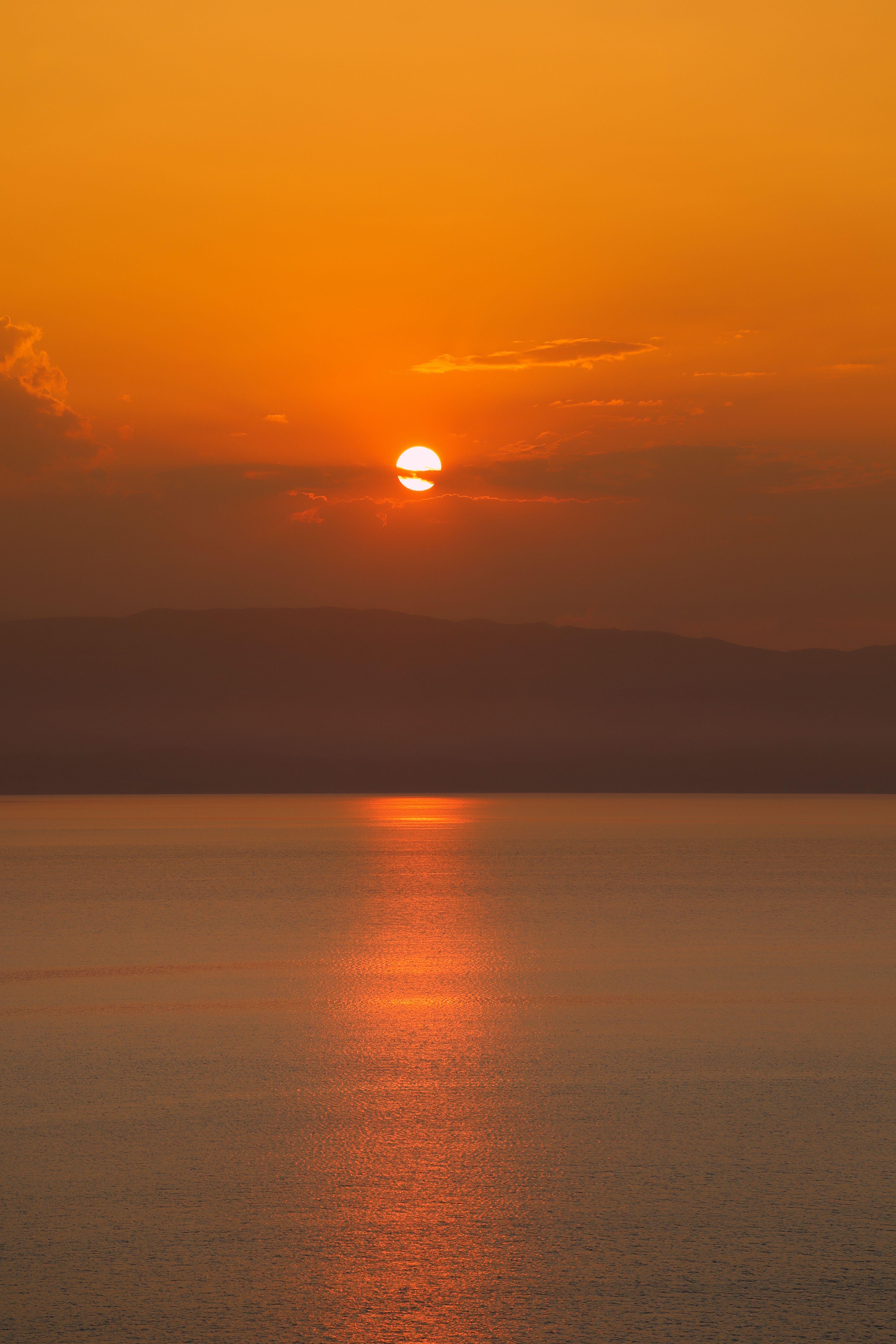 Stunning Orange Sunset Over Calm Water · Free Stock Photo