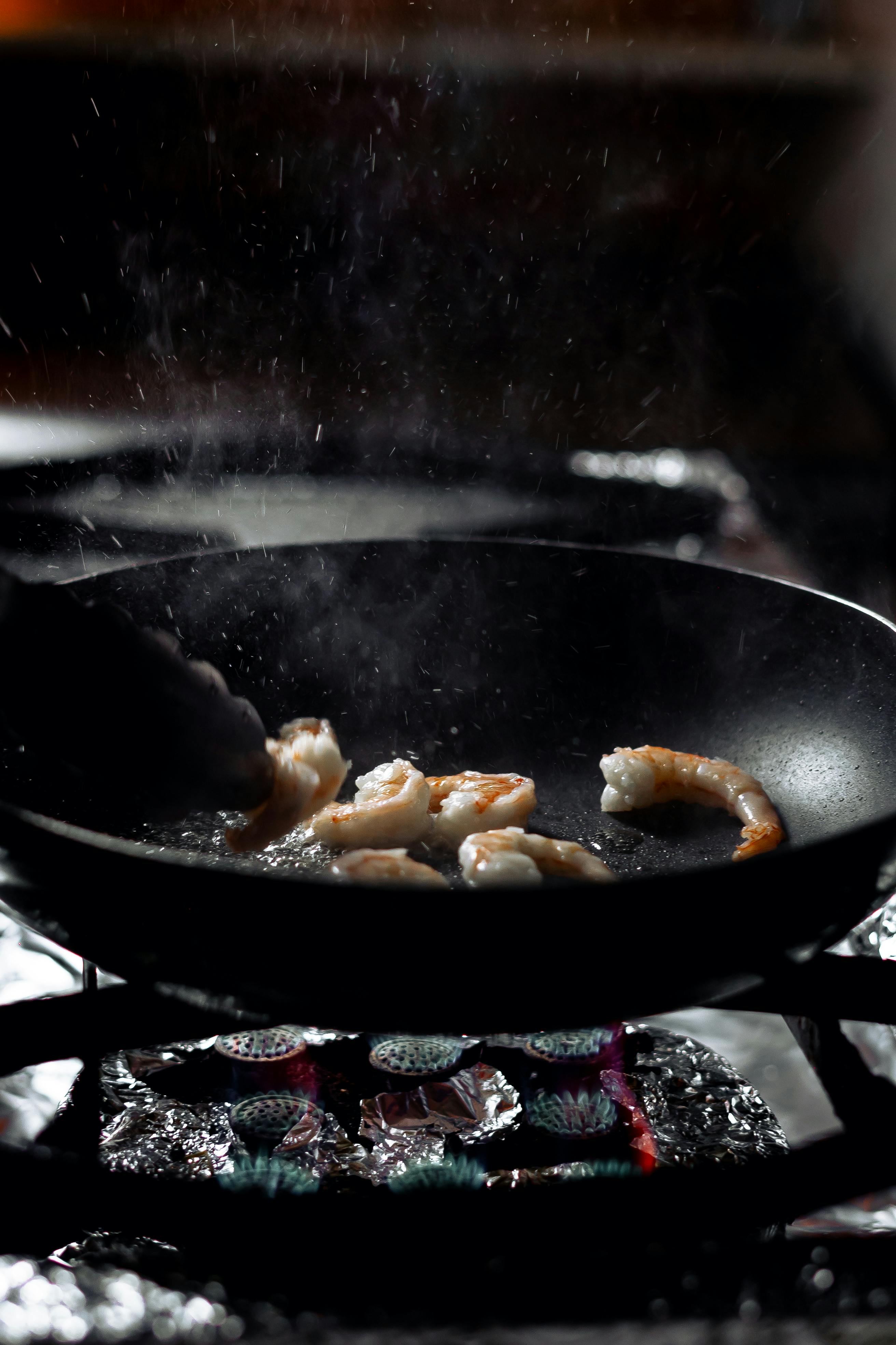 Woman Eating on Cooking Pan · Free Stock Photo