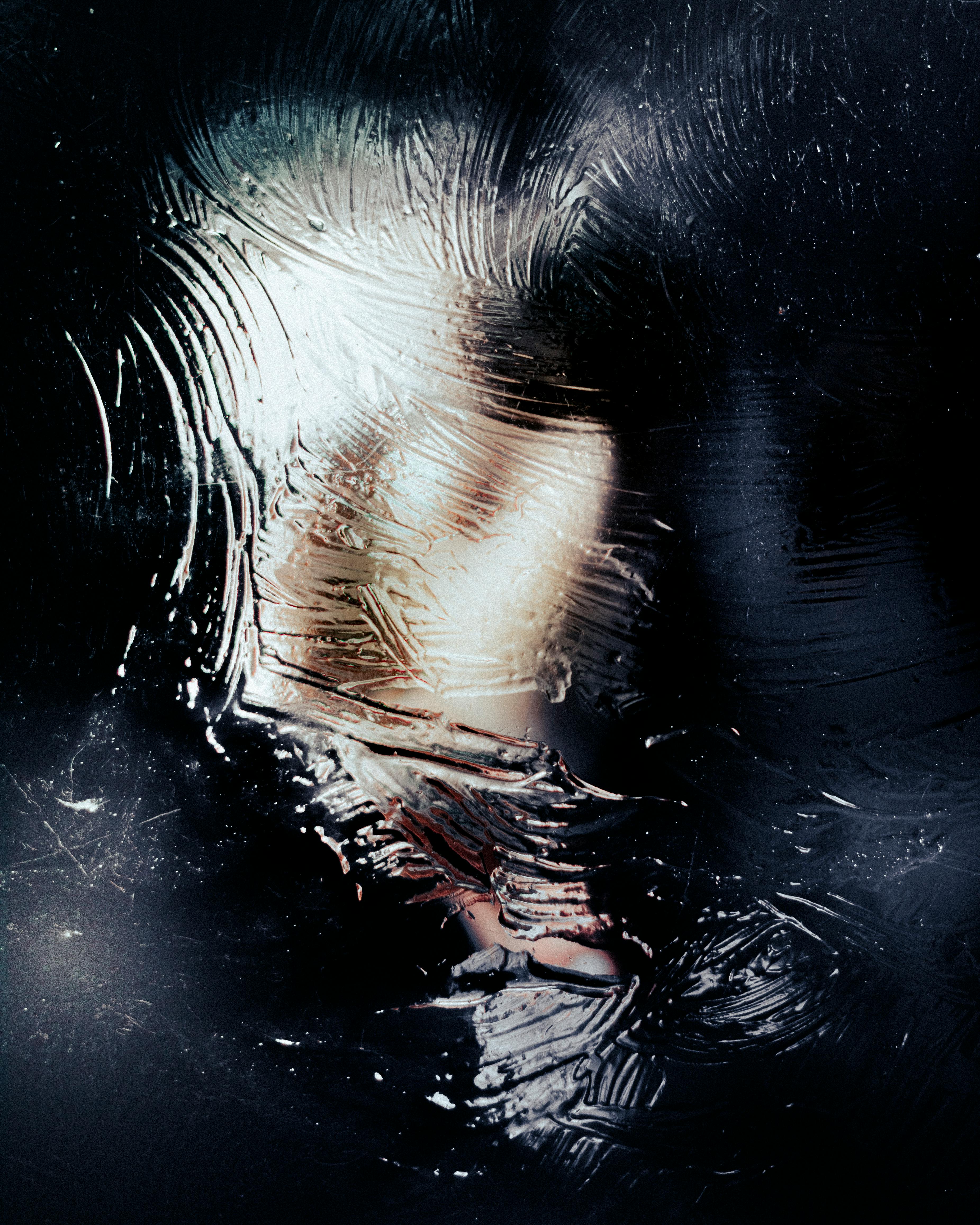 Abstract Blurred Figure Behind Textured Glass · Free Stock Photo