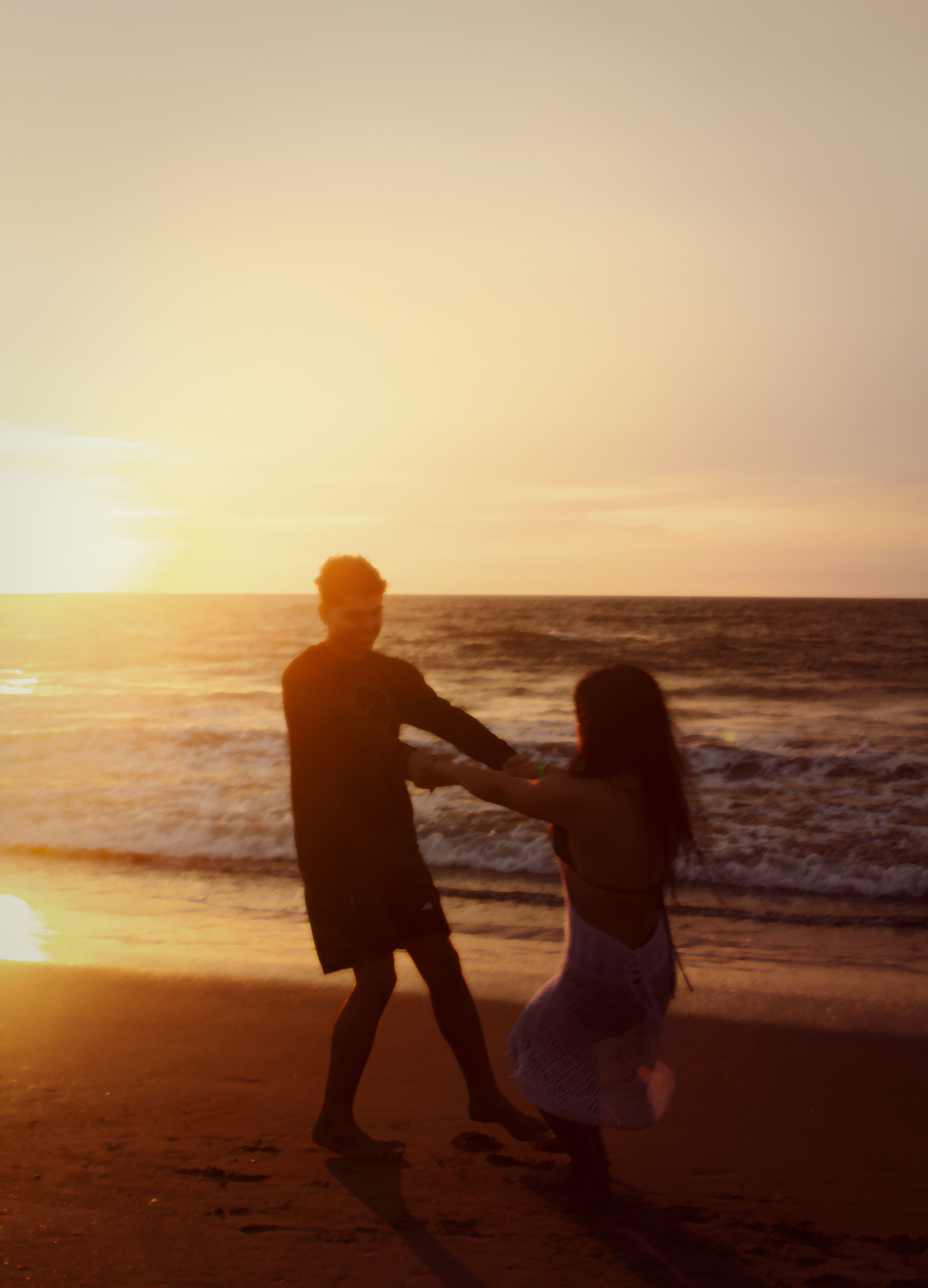 Romantic Couple Dancing at Sunset Beach · Free Stock Photo
