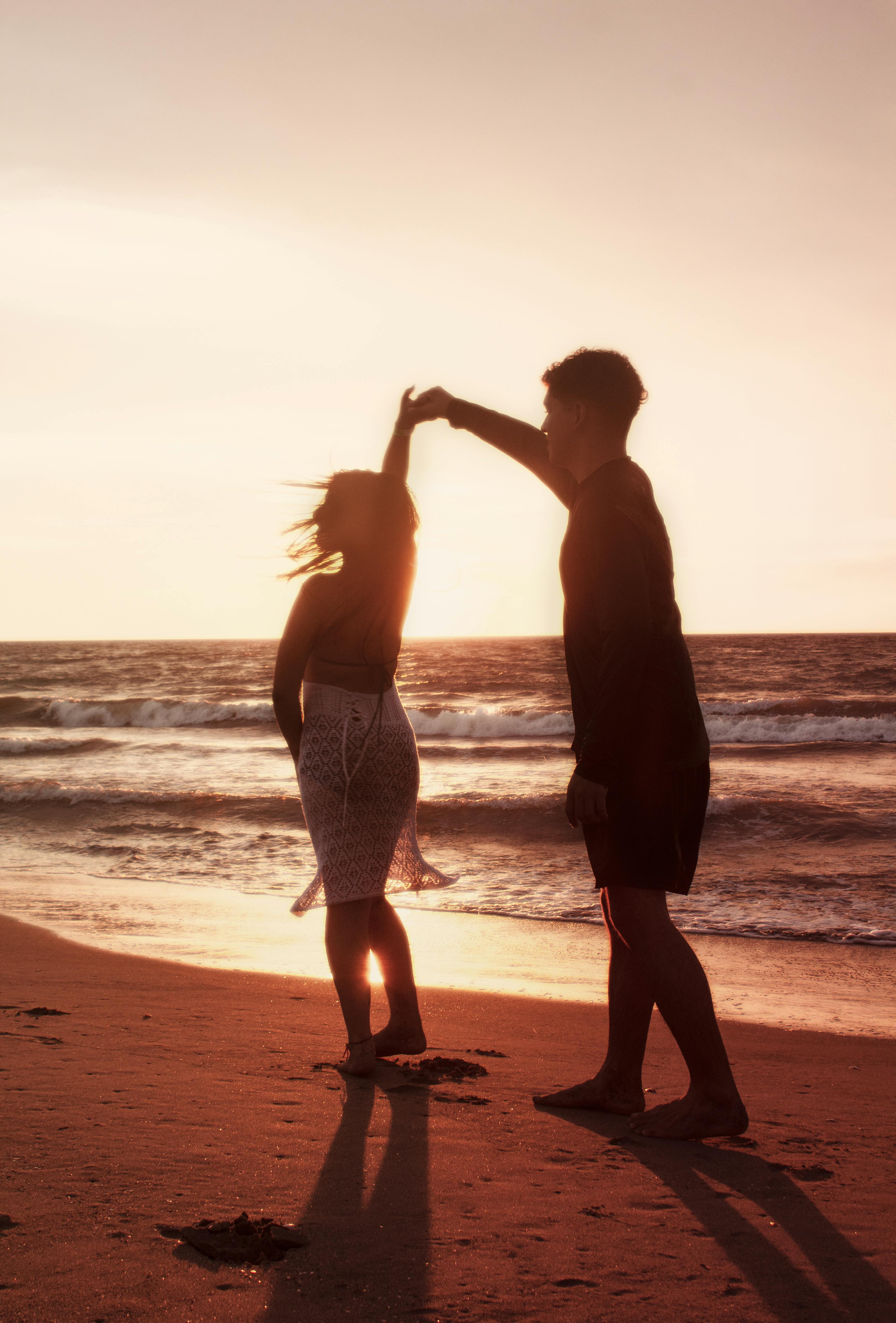 Romantic Sunset Beach Dance Silhouette · Free Stock Photo